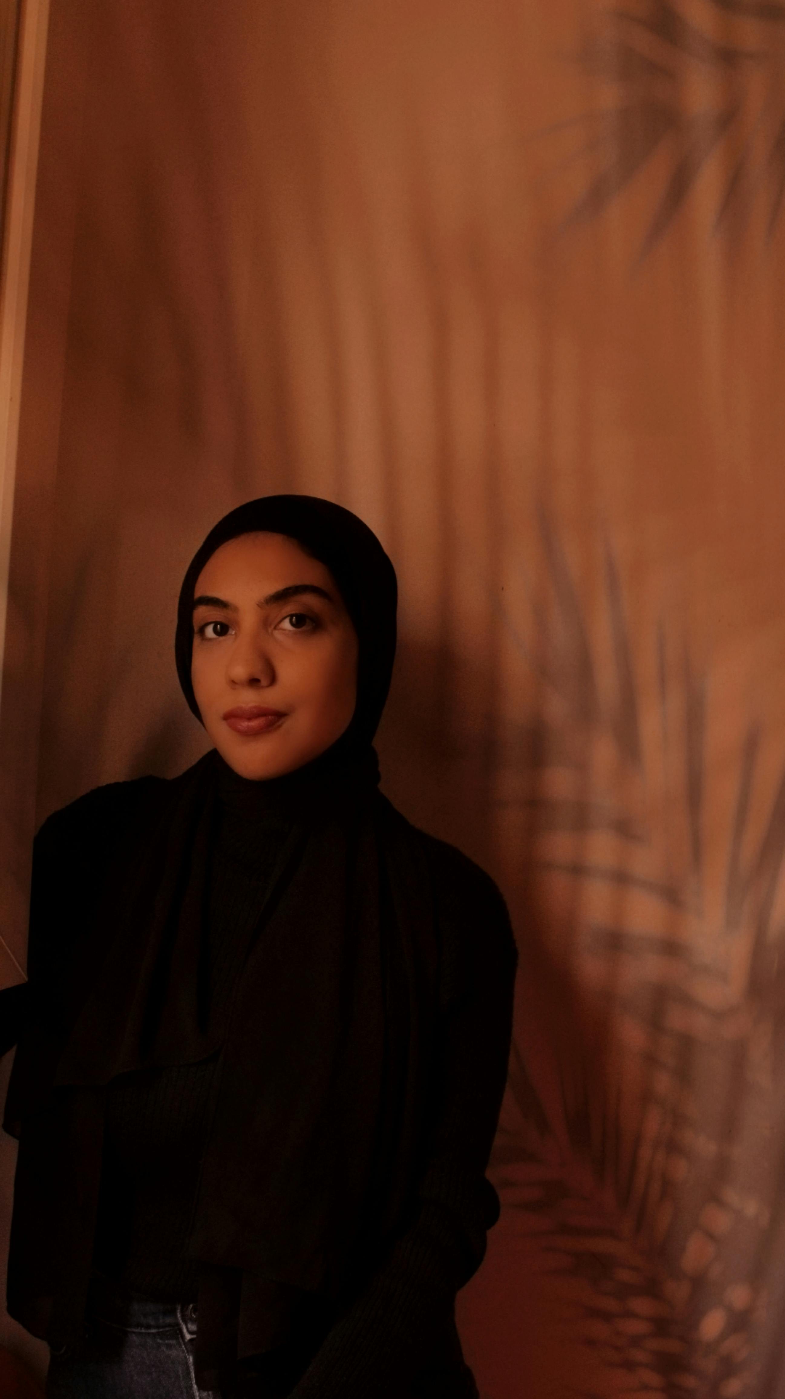 A Woman Posing in Black Abaya and Hijab · Free Stock Photo