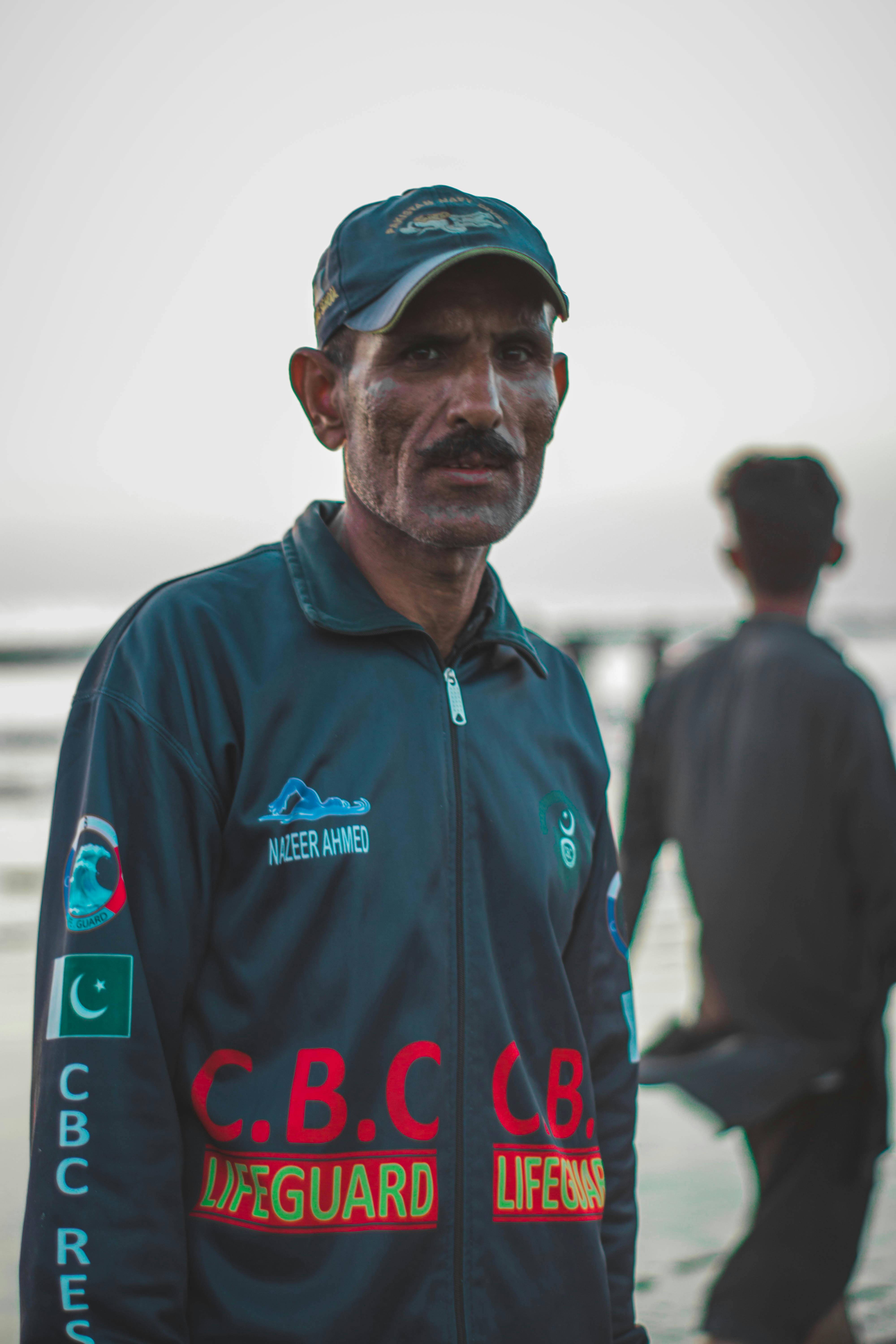 A Woman on the Bridge Wearing Cap · Free Stock Photo