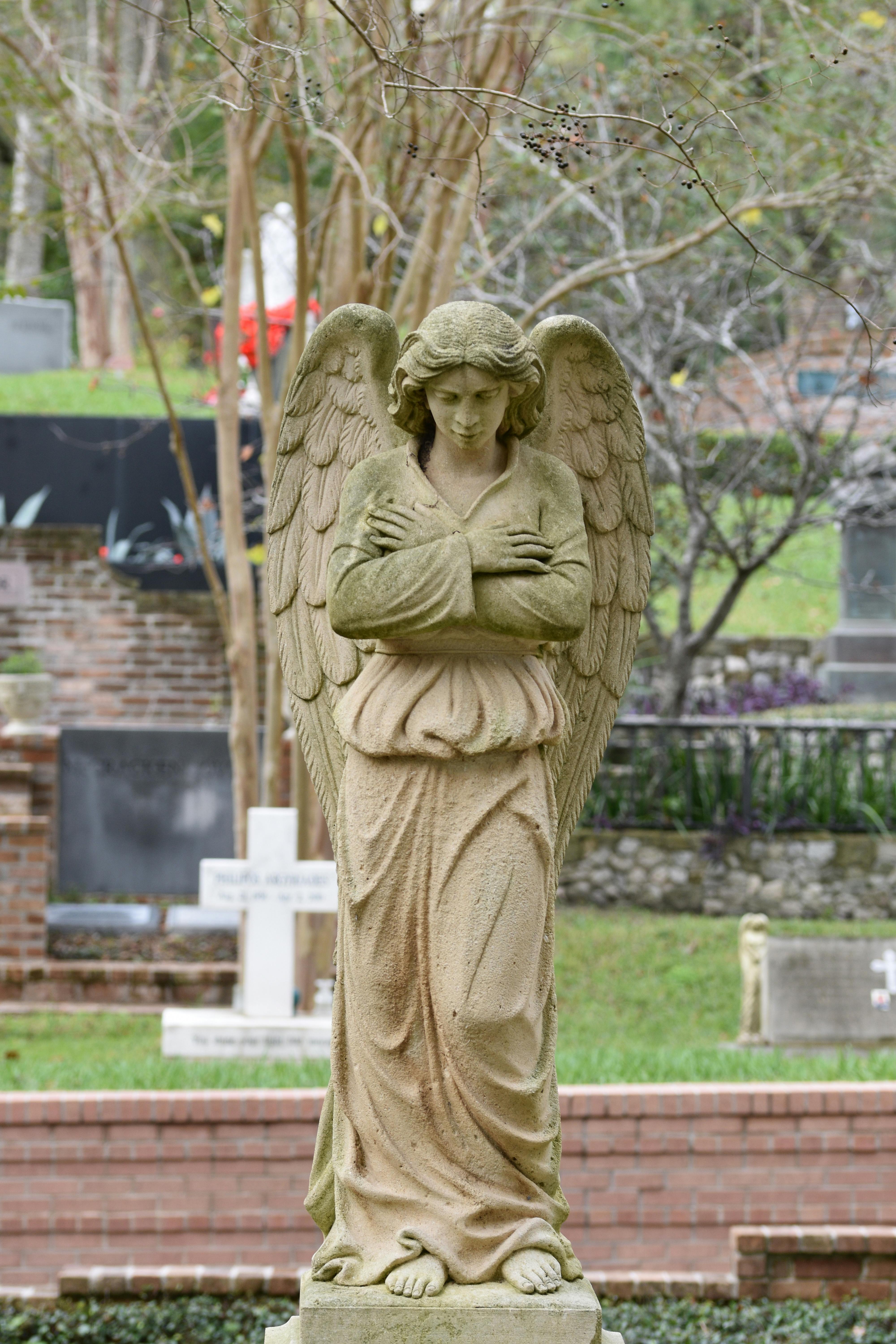 Two White Concrete Statues Covered by Dust · Free Stock Photo