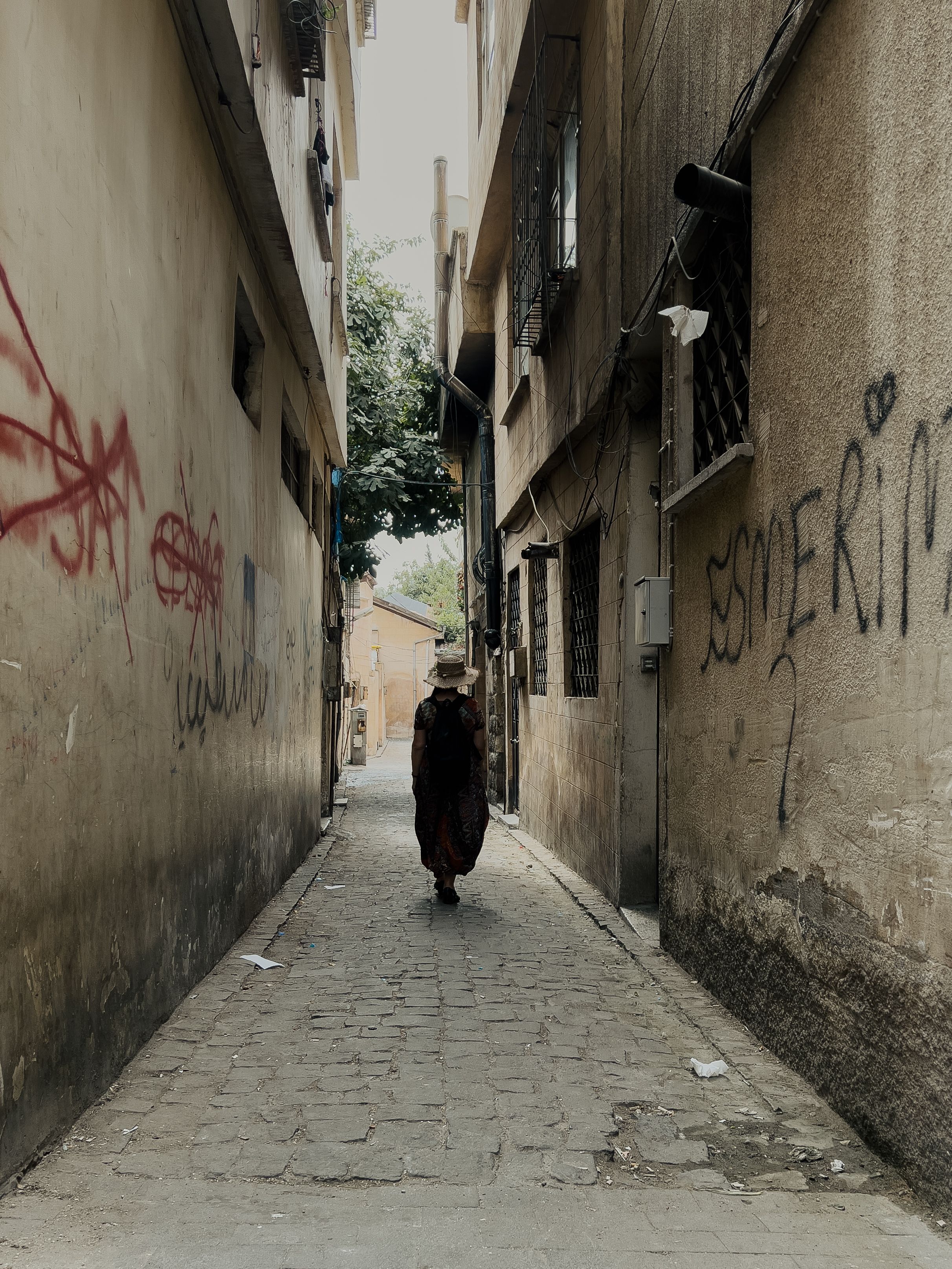 Woman Walking on Alley · Free Stock Photo