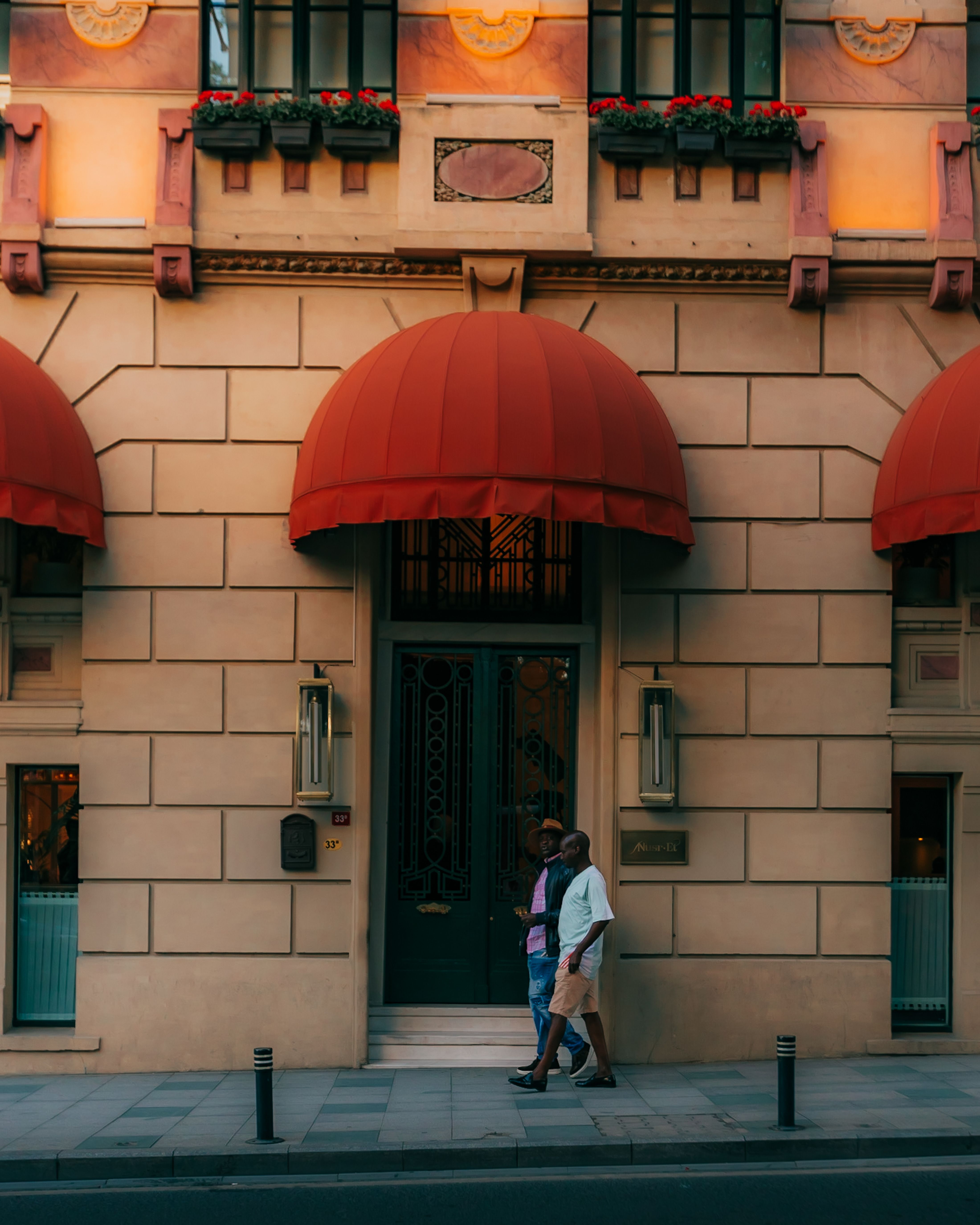 Man Walking in front of a Restaurant · Free Stock Photo