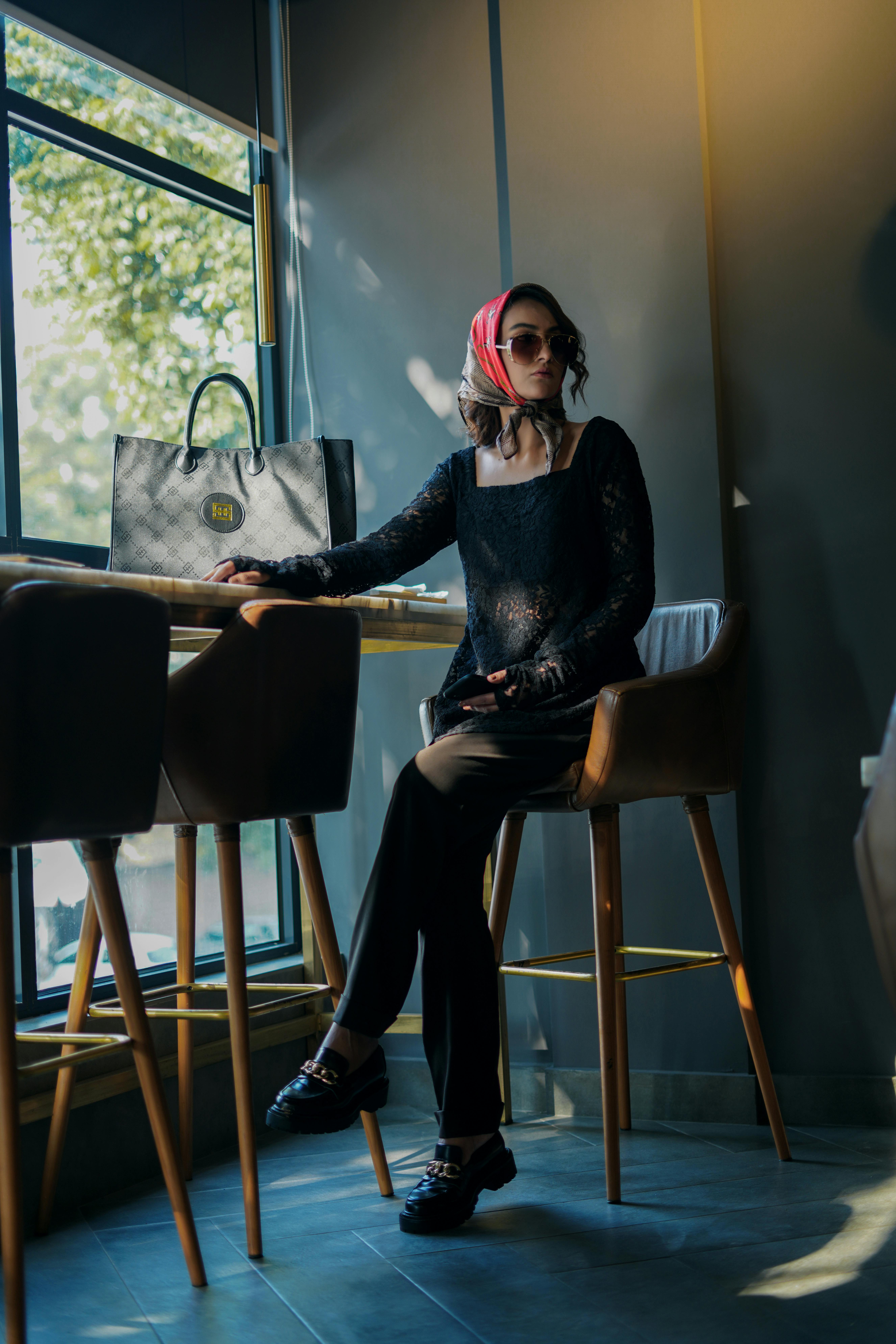 Stylish Woman Sitting on a Bar Stool · Free Stock Photo