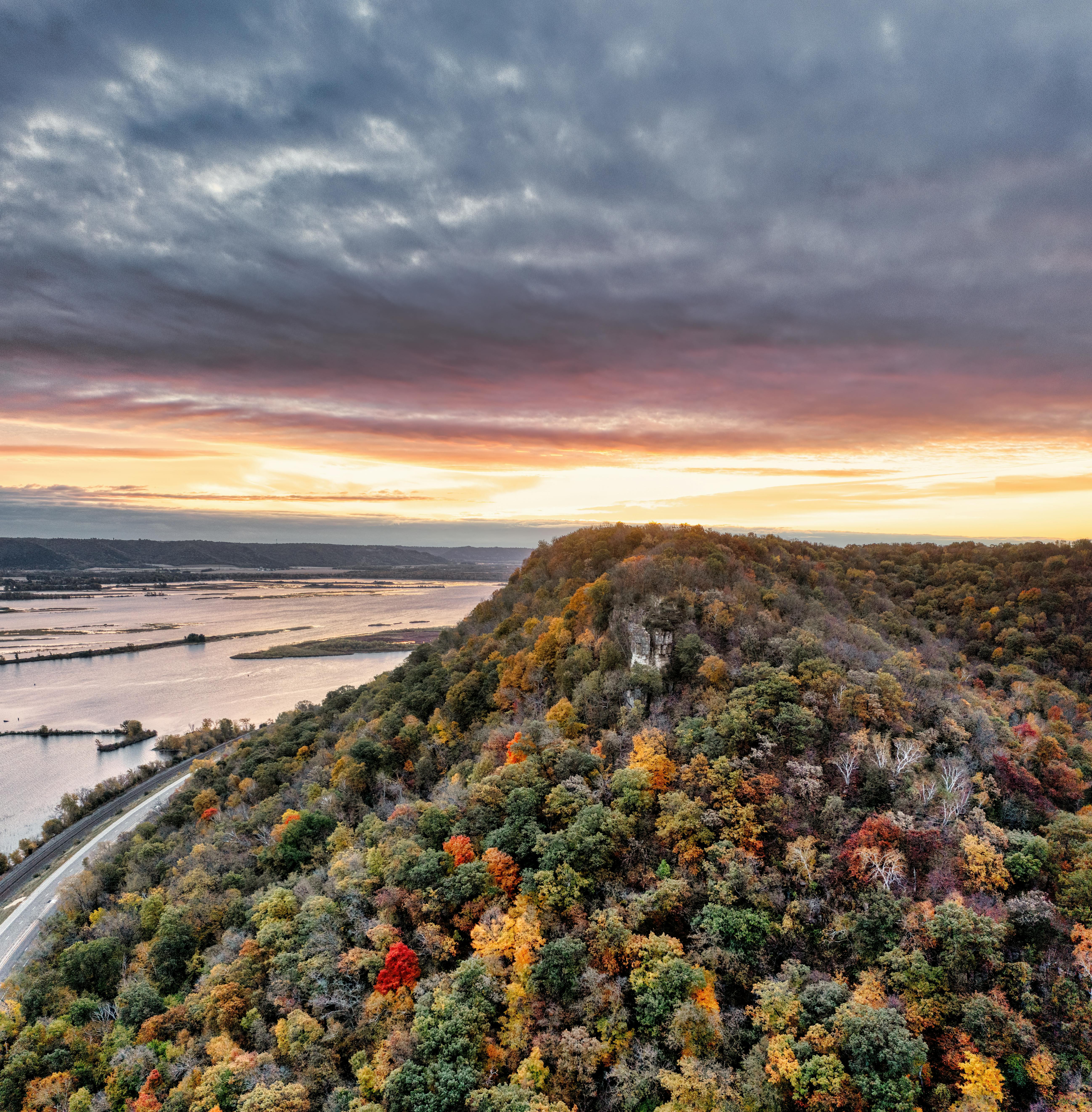 Clouds over Forest on Hill near River at Sunset · Free Stock Photo