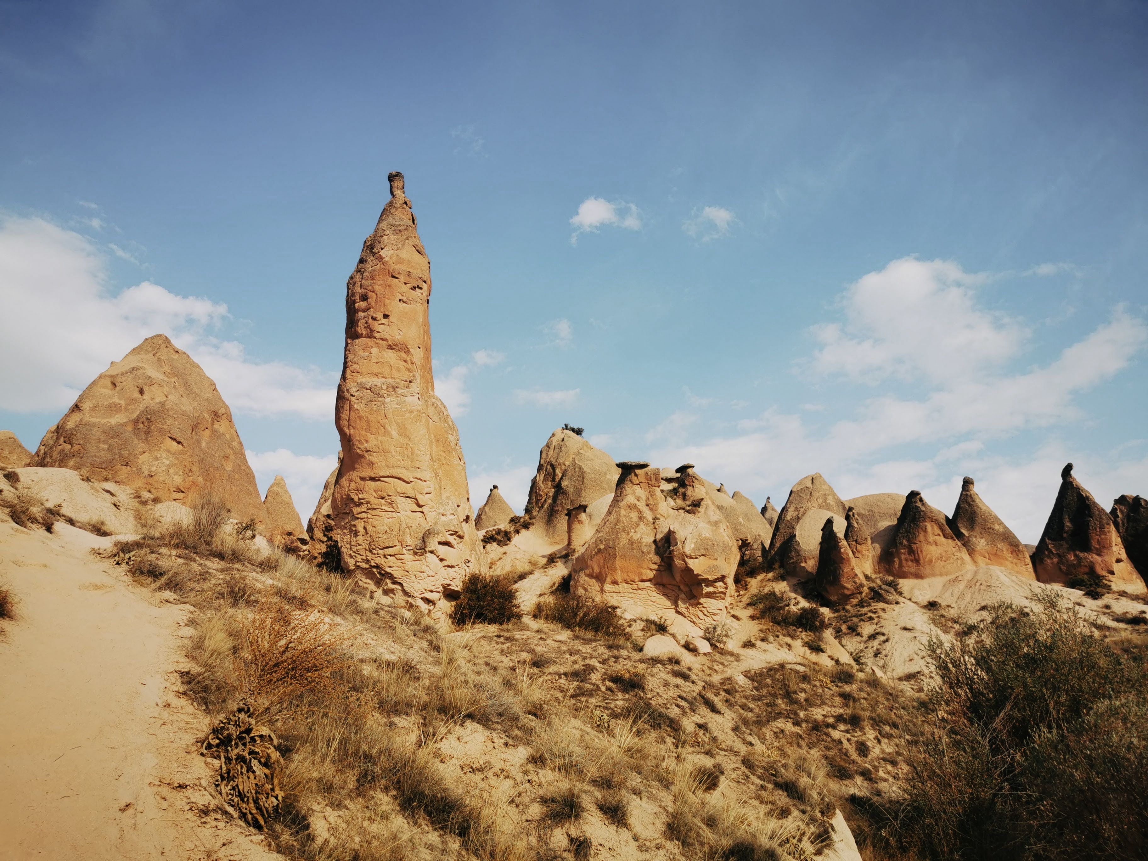 Balloon Flying over Rock Formations · Free Stock Photo