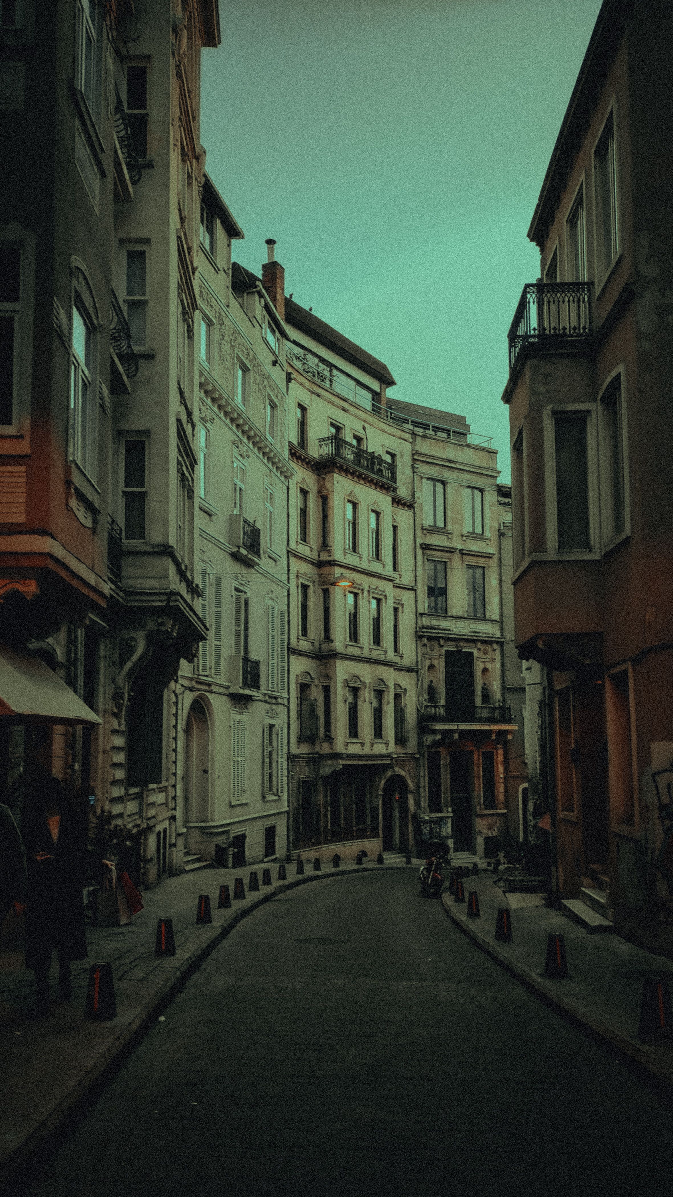 Stone Paved Alley in Between Concrete Buildings · Free Stock Photo