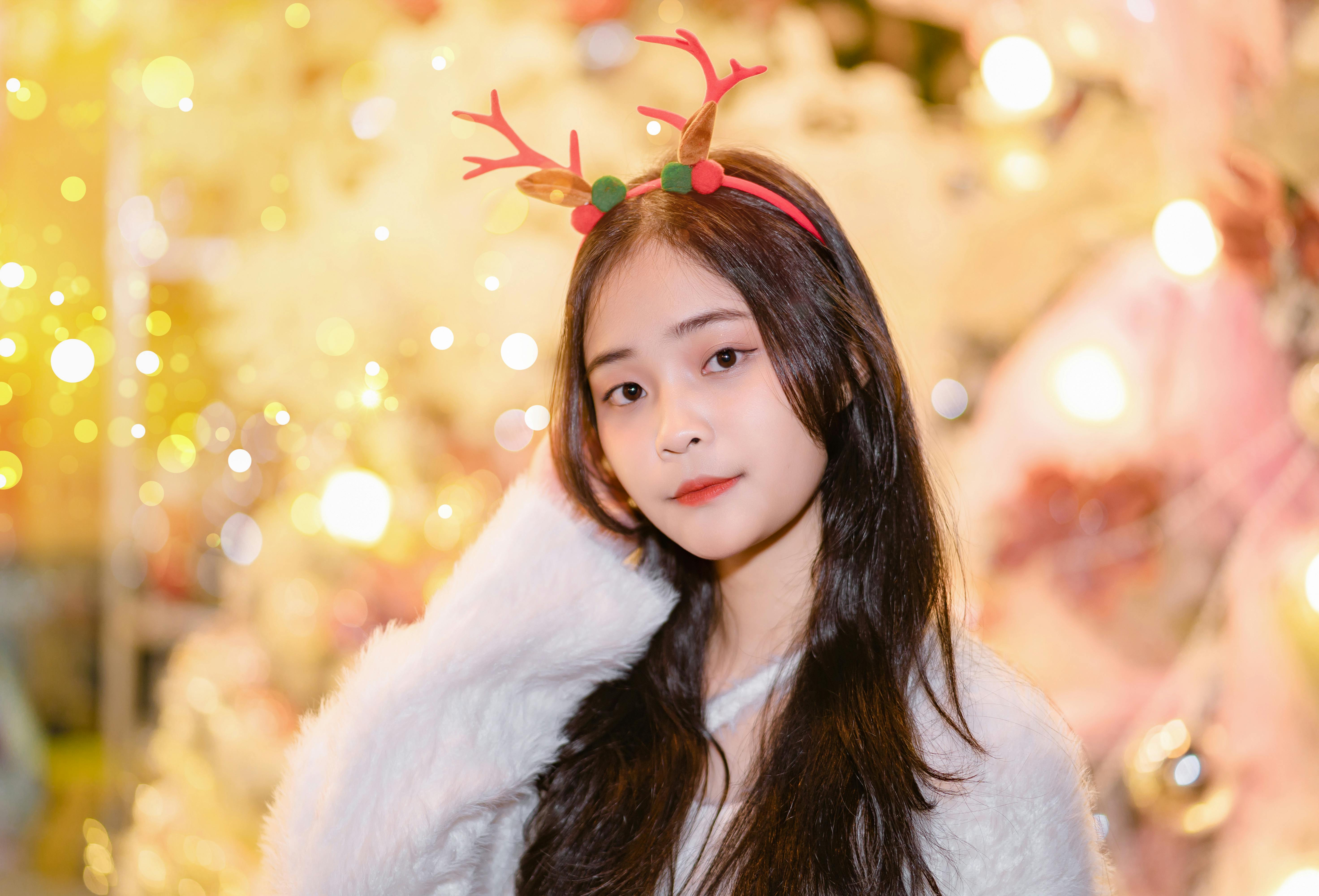 Teenage Girl Standing Beside Clothing Rack · Free Stock Photo