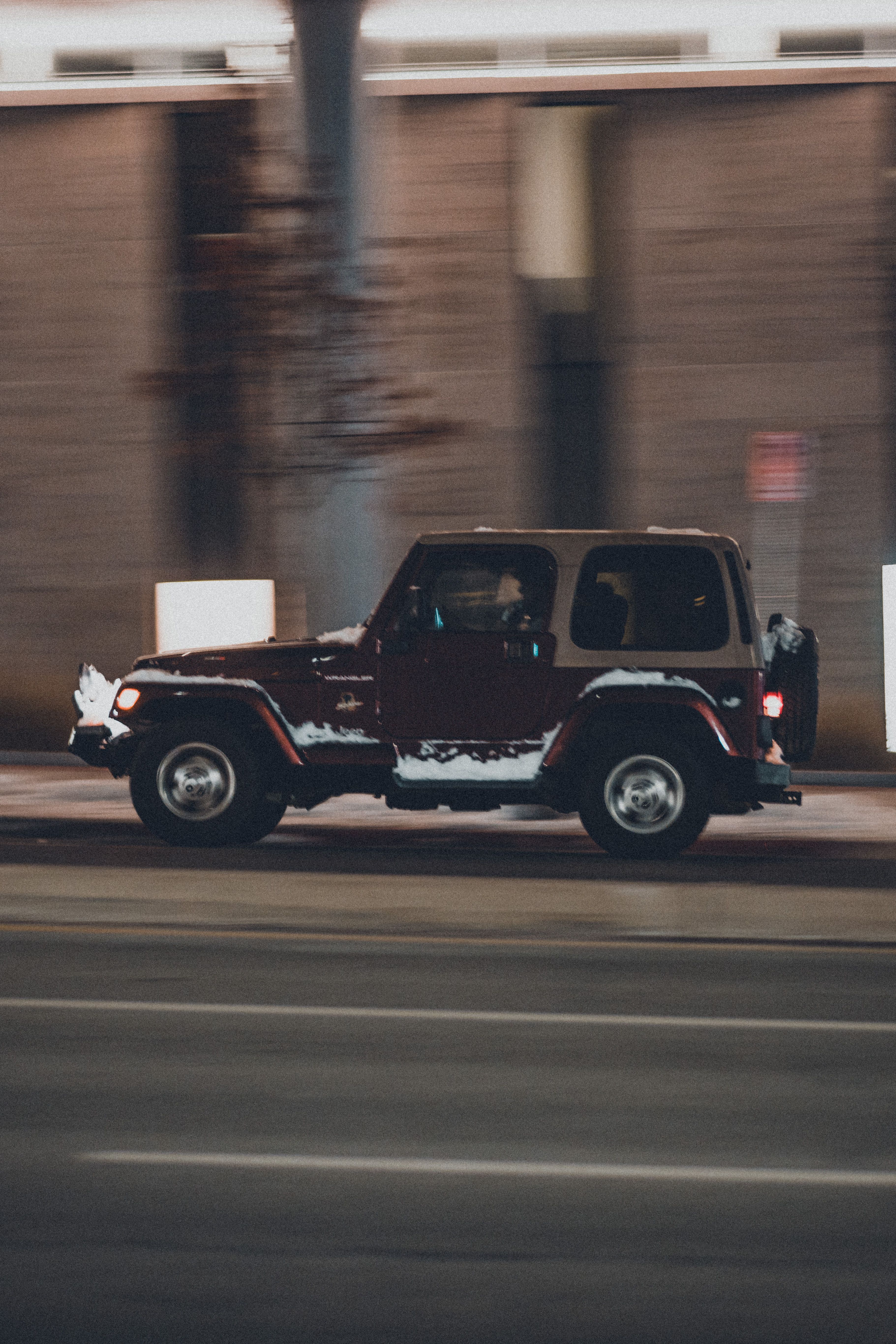 Offroad Car Driving on City Street · Free Stock Photo