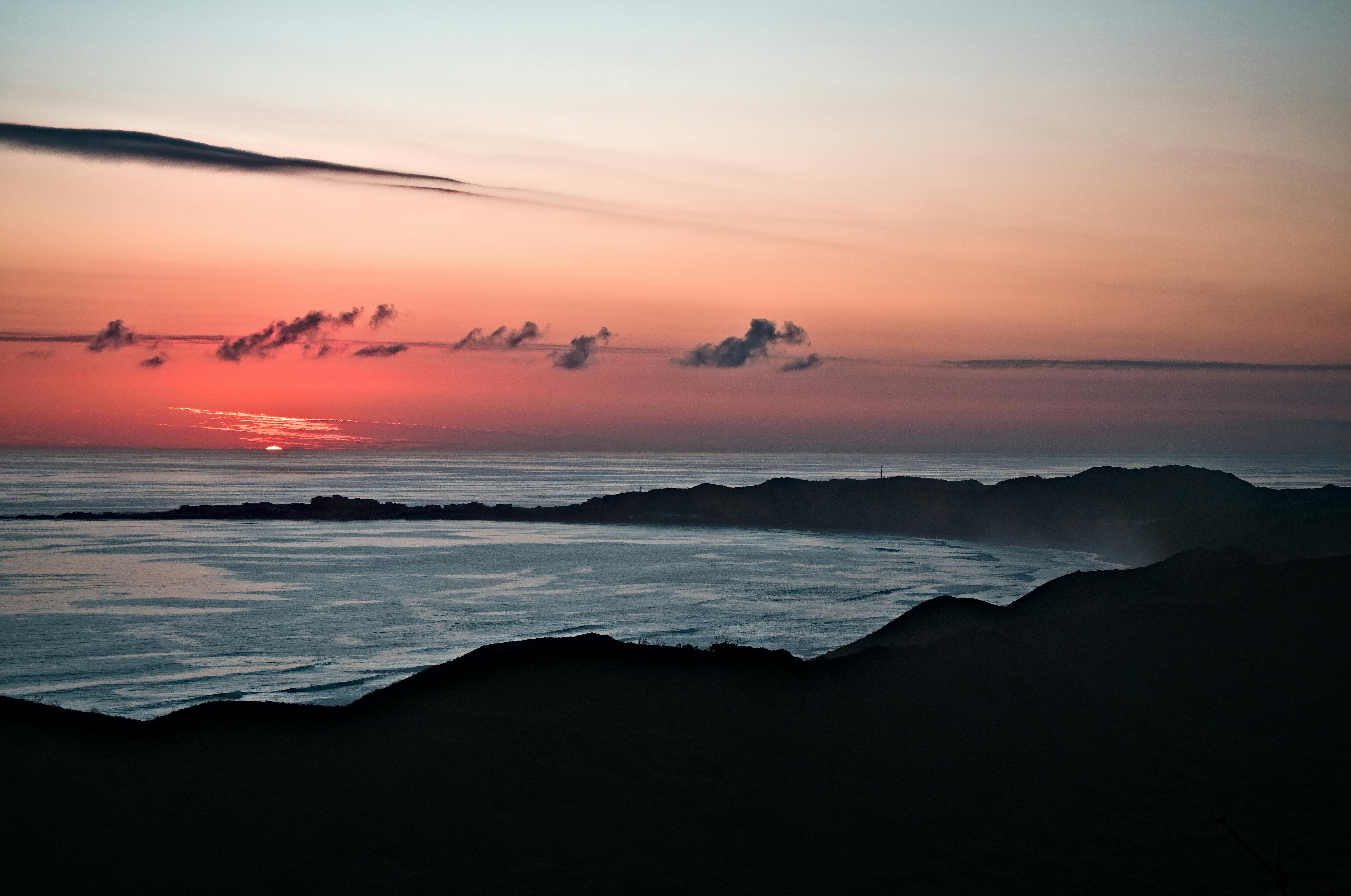 Red Sky at Sunset over Sea Shore · Free Stock Photo