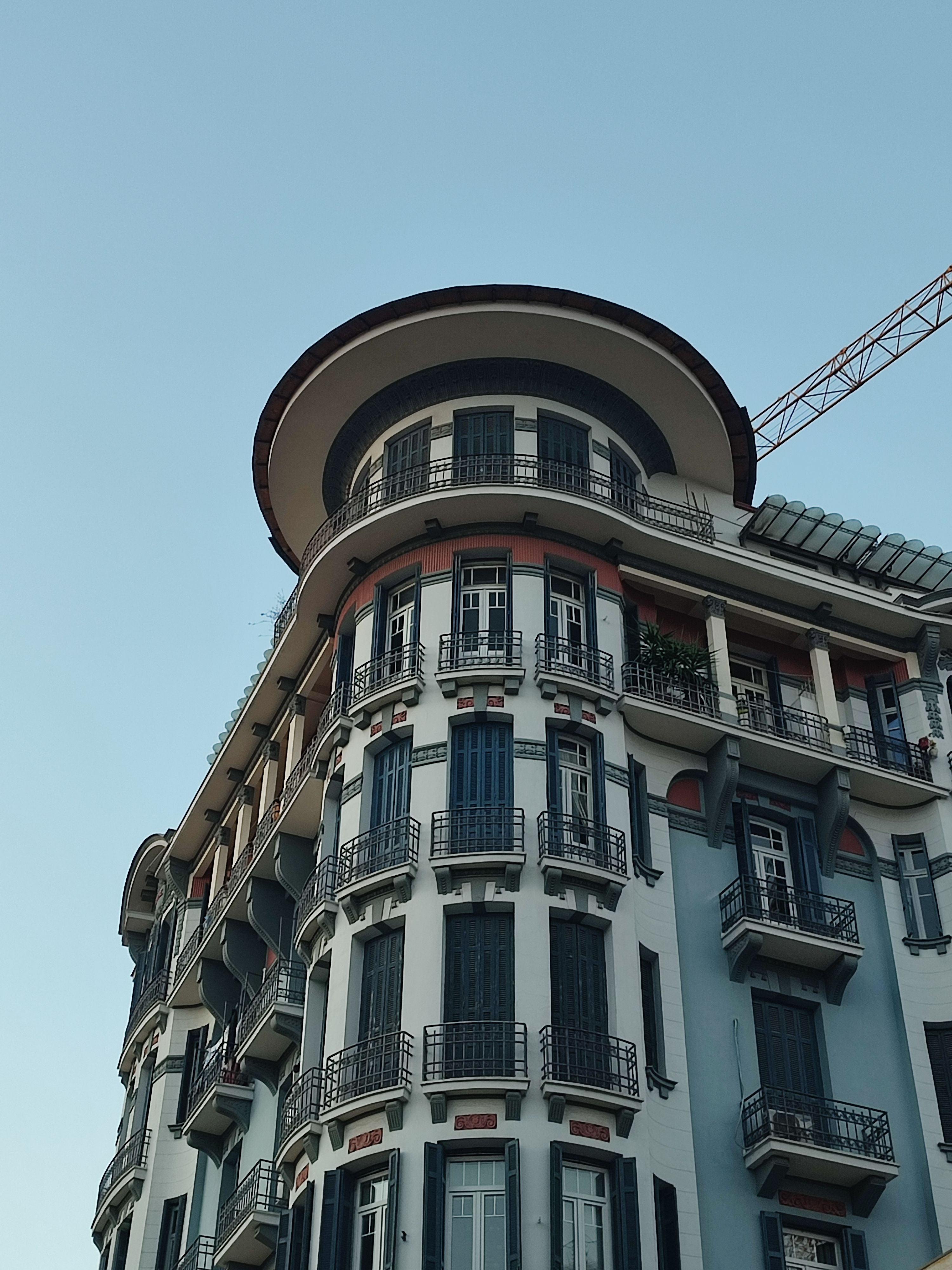 Clear Sky over Building Corner · Free Stock Photo