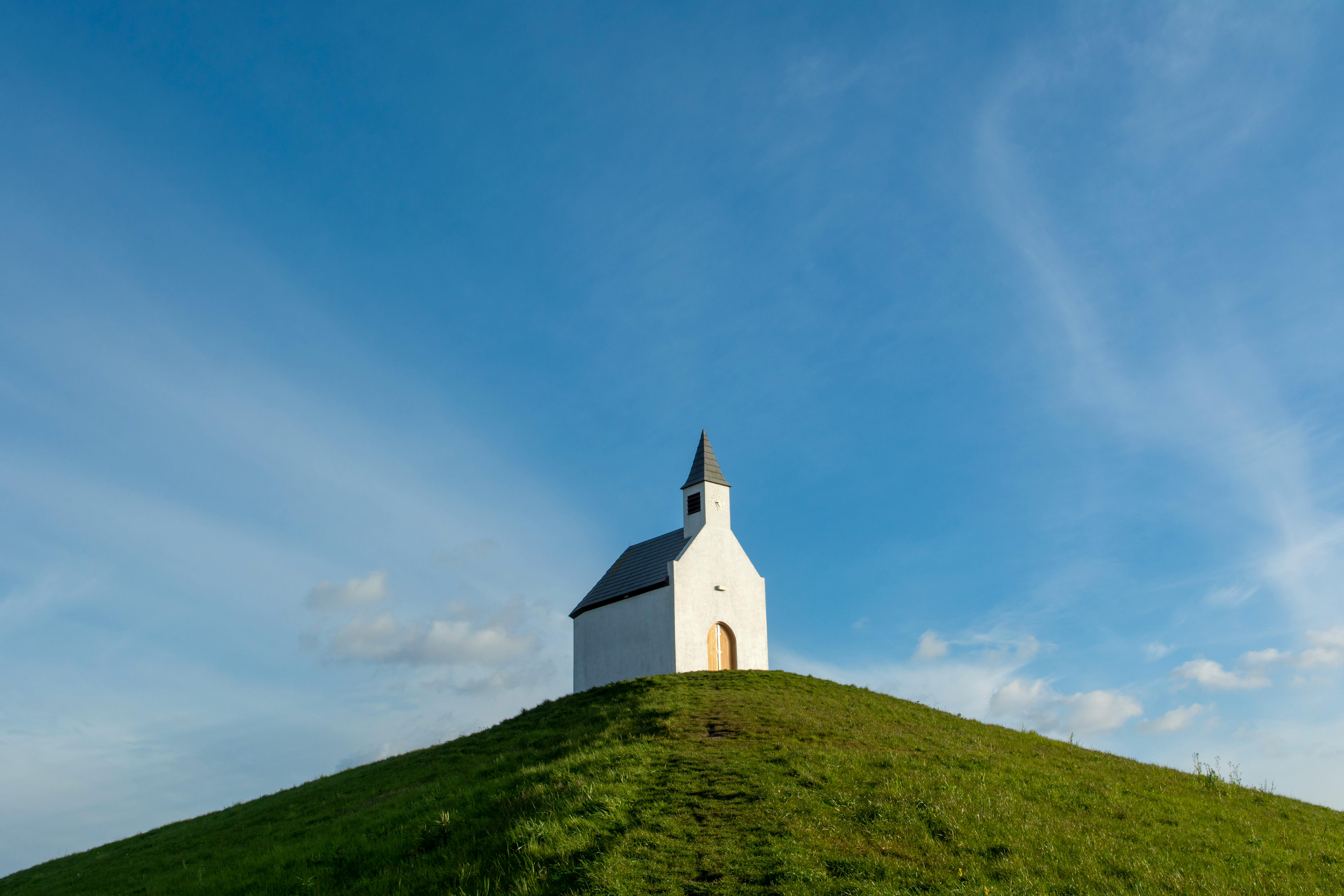 White Church in Green Grass Field Under Blue Sky · Free Stock Photo