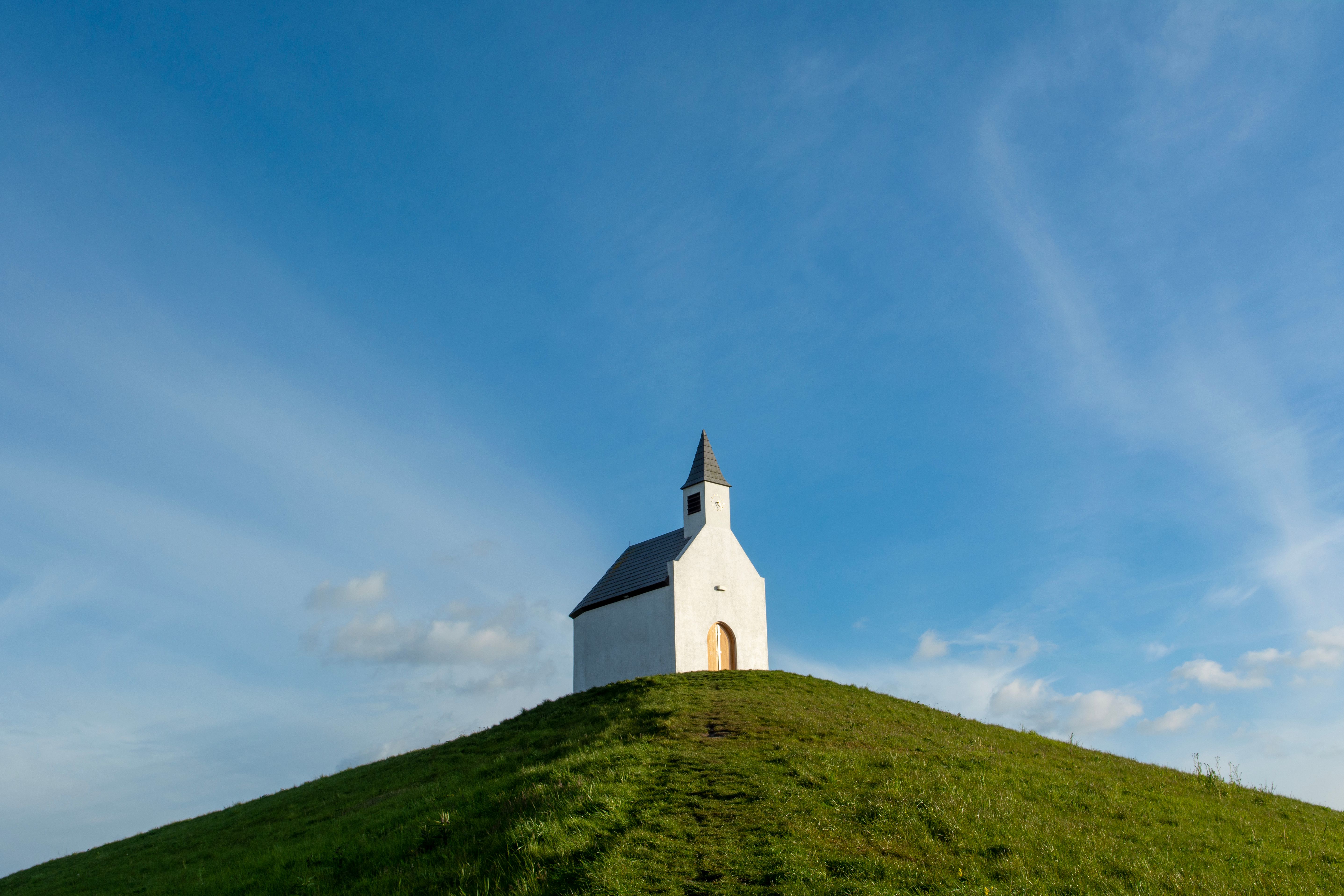 White Church in Green Grass Field Under Blue Sky · Free Stock Photo