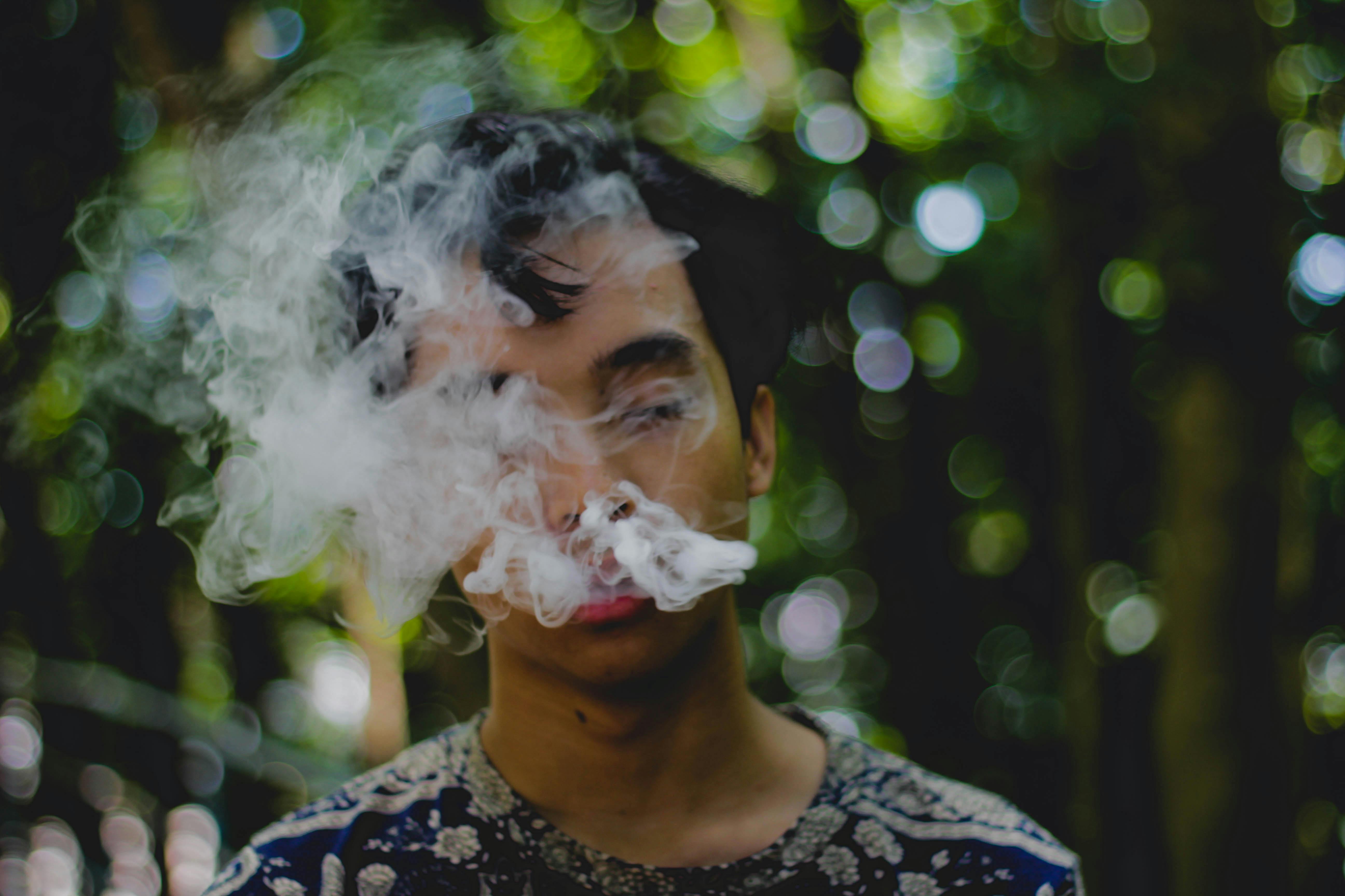 Person Exhaling Smoke · Free Stock Photo