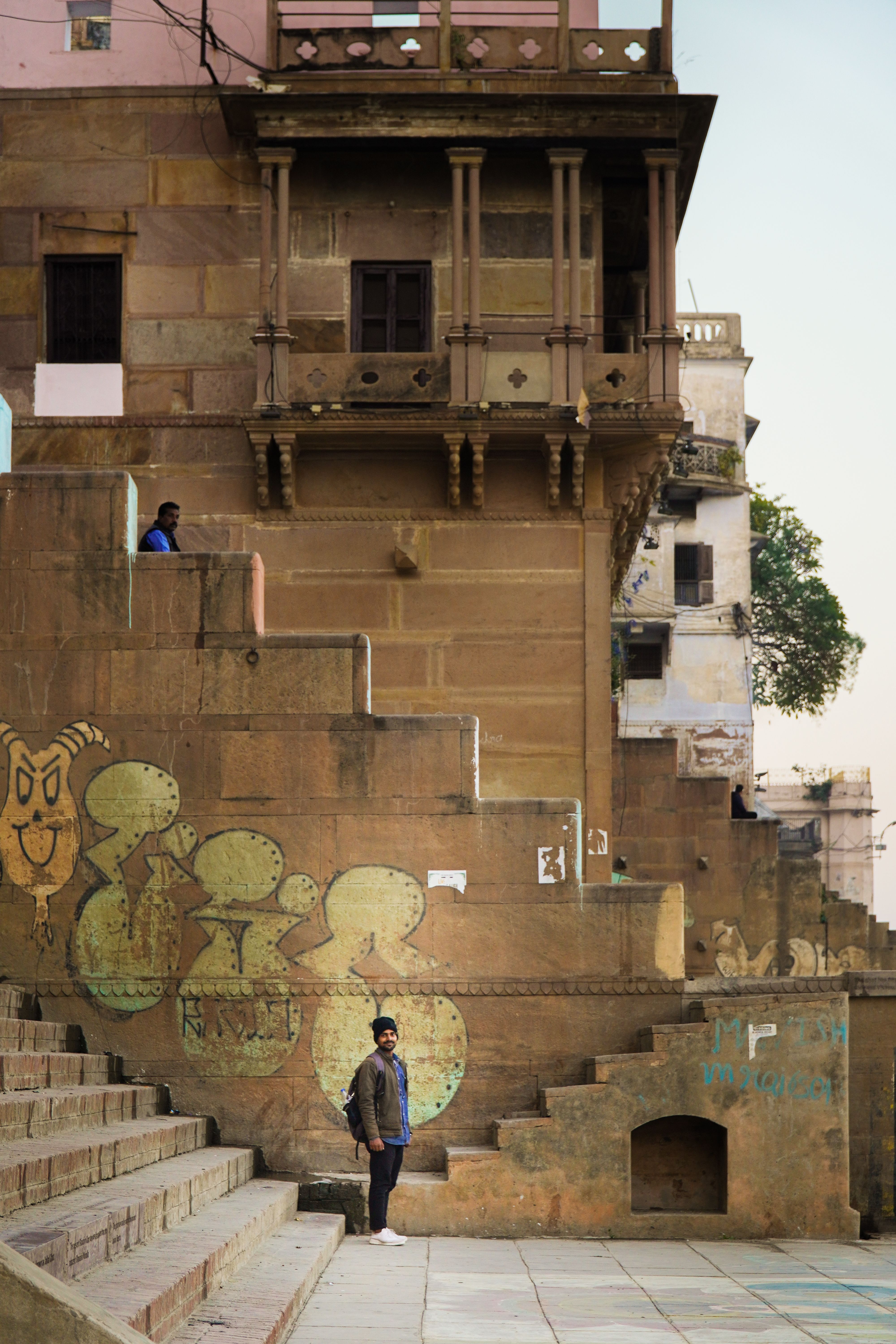 Person Standing Beside a Staircase · Free Stock Photo
