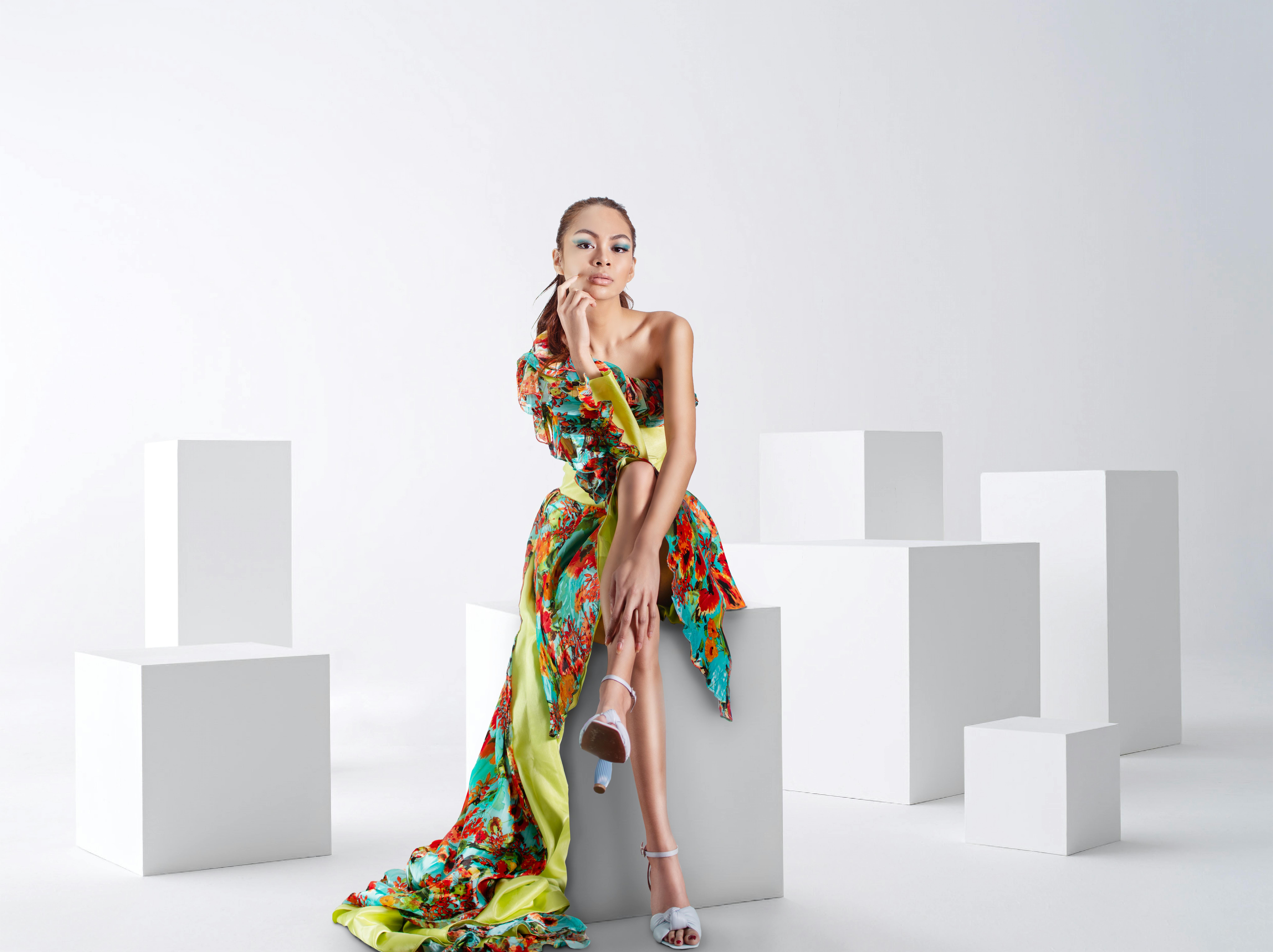 Female Fashion Model Crouching Against a White Background · Free Stock ...