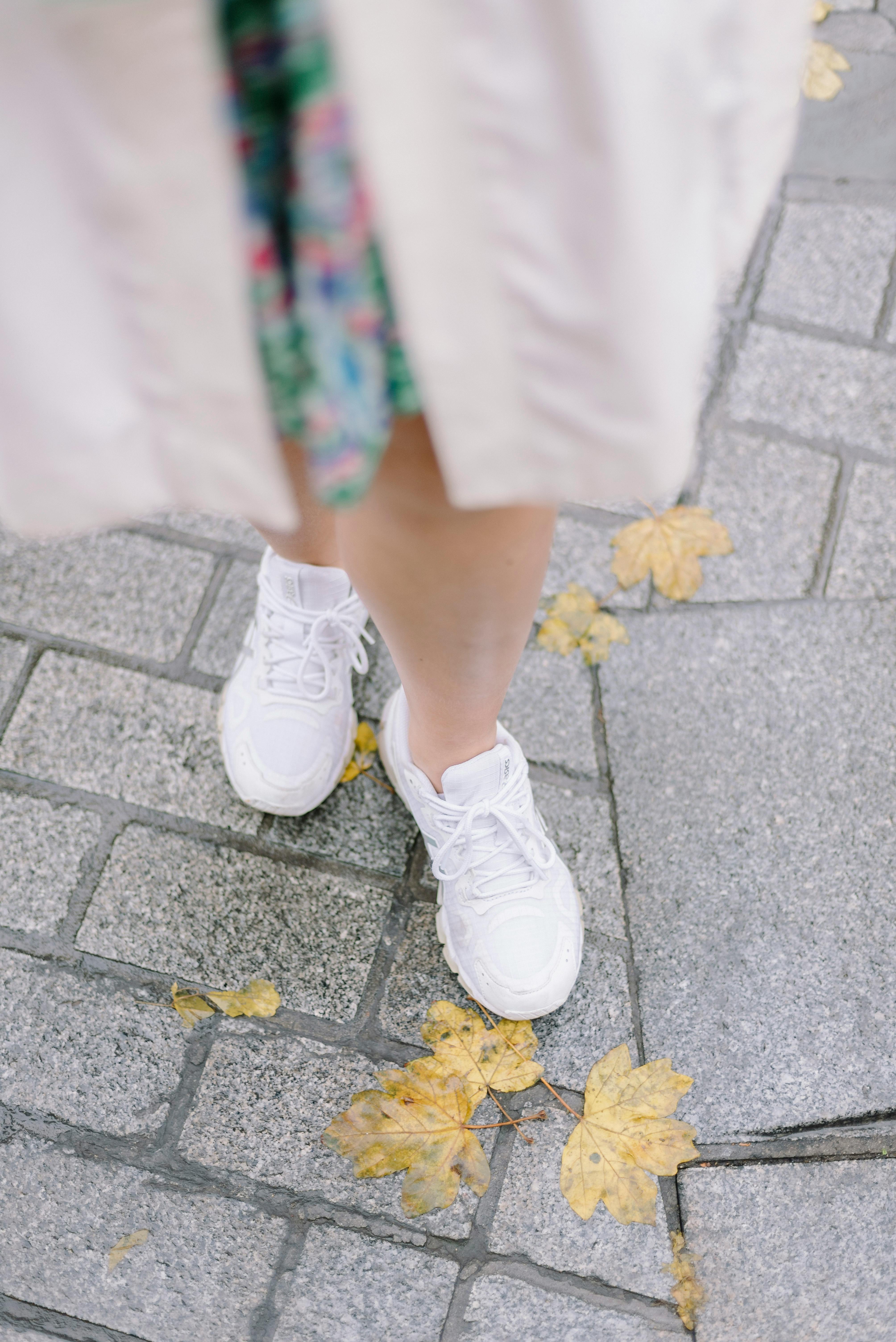 White Sneakers on Pavement · Free Stock Photo