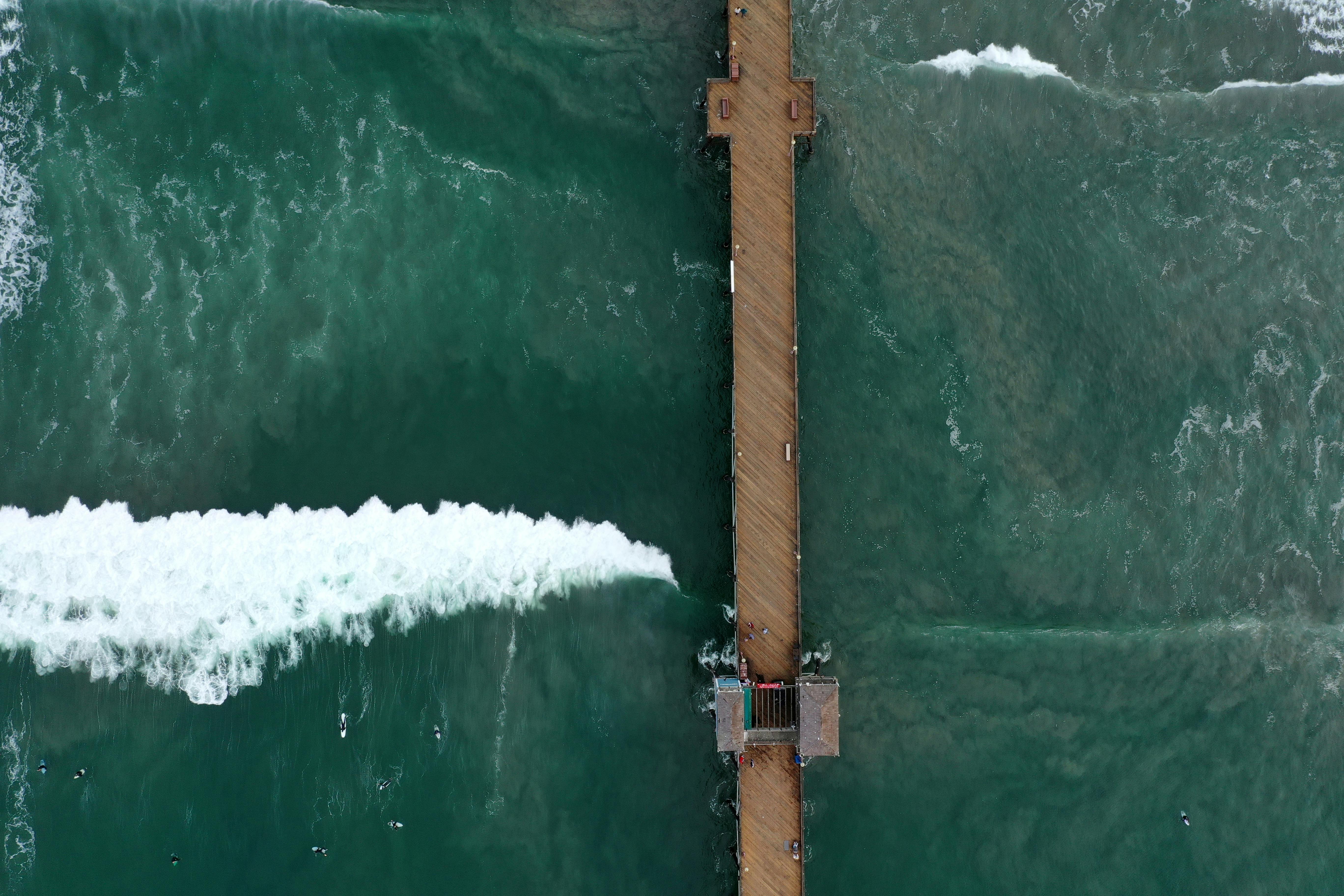 Aerial Shot of Wooden Dock in the Ocean · Free Stock Photo
