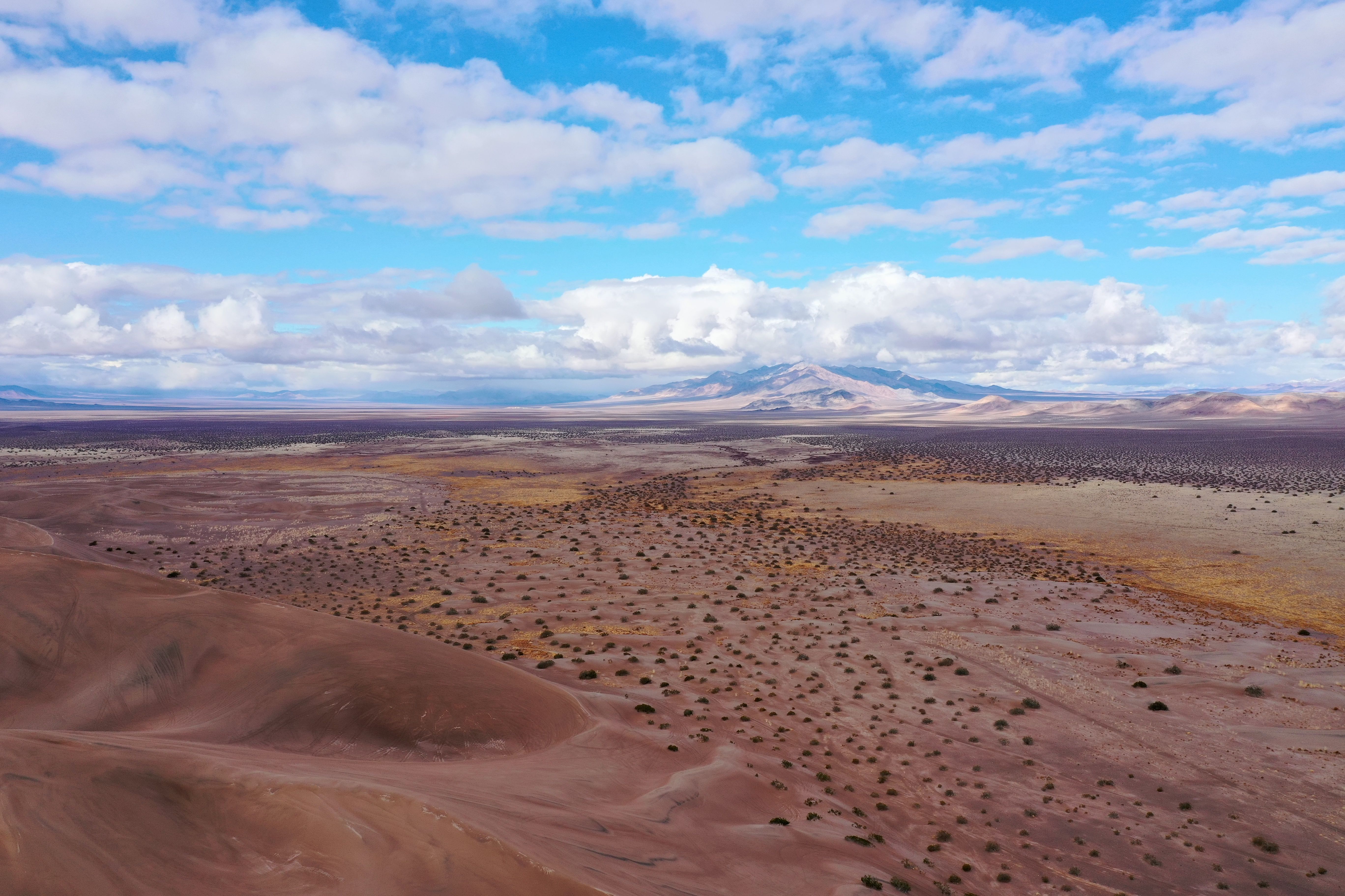 Rolling Desert Landscape and Clouds · Free Stock Photo