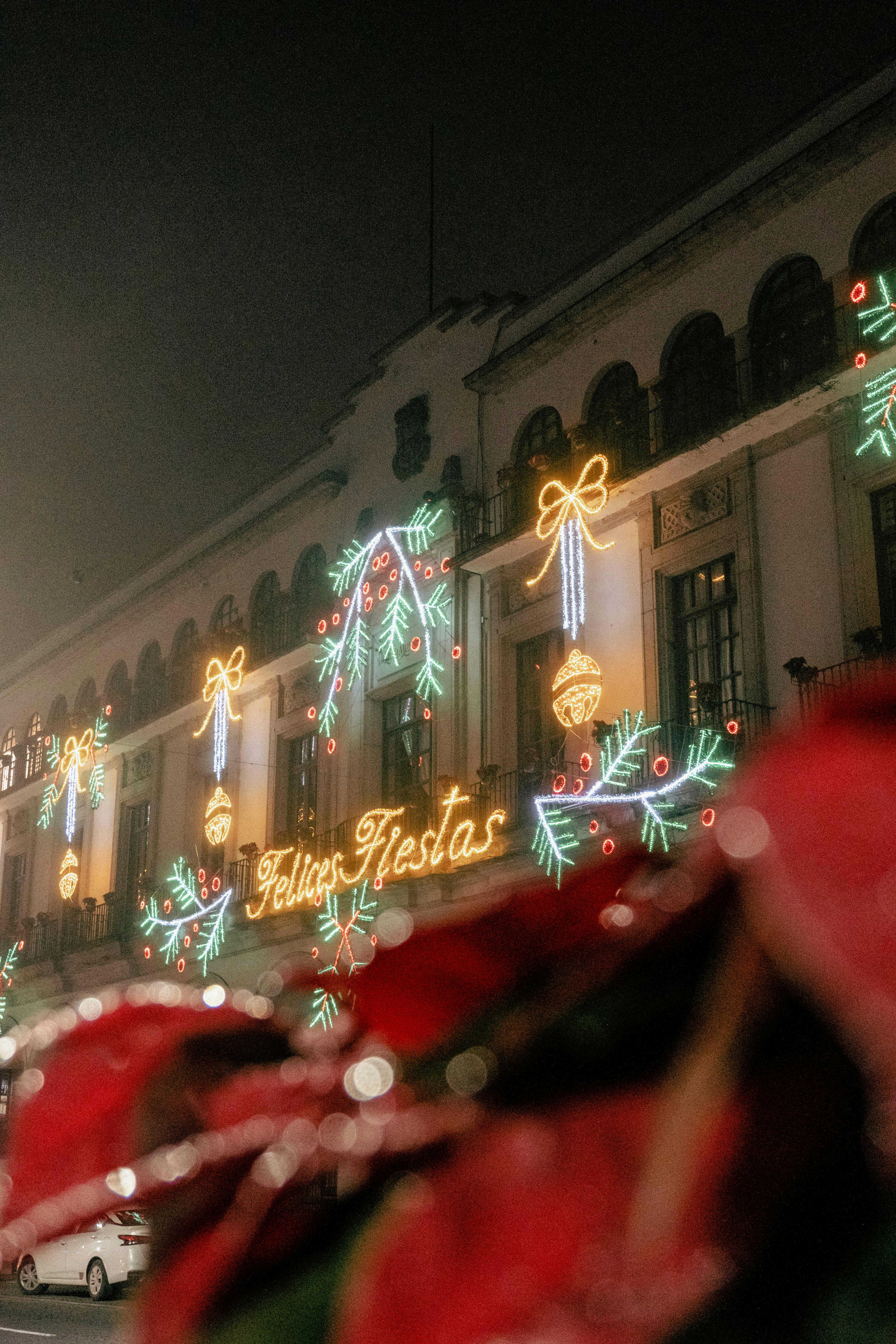 A Concrete Building with Christmas Lights Decorations · Free Stock Photo