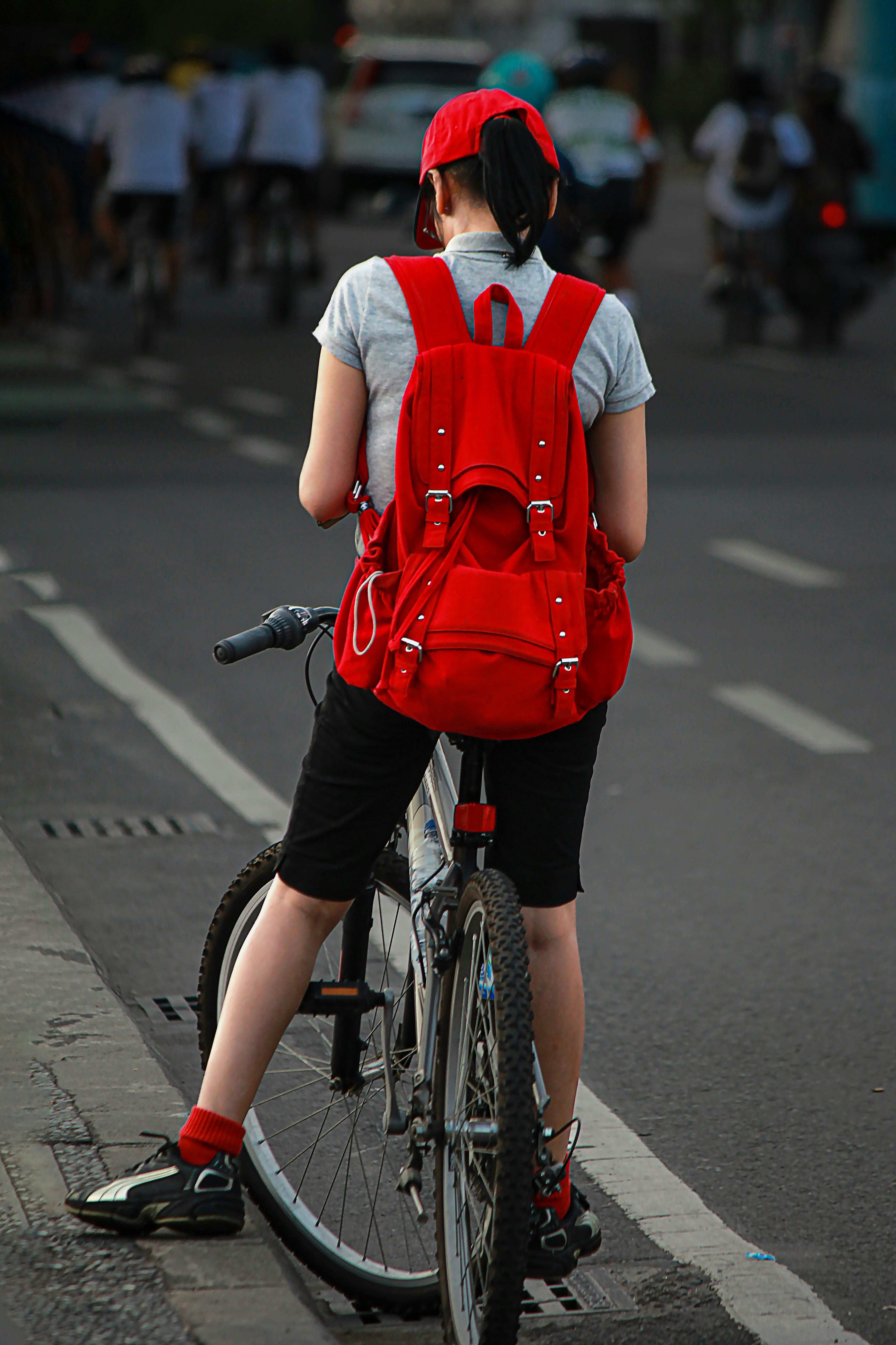 Woman Pushing an Electric Bike · Free Stock Photo