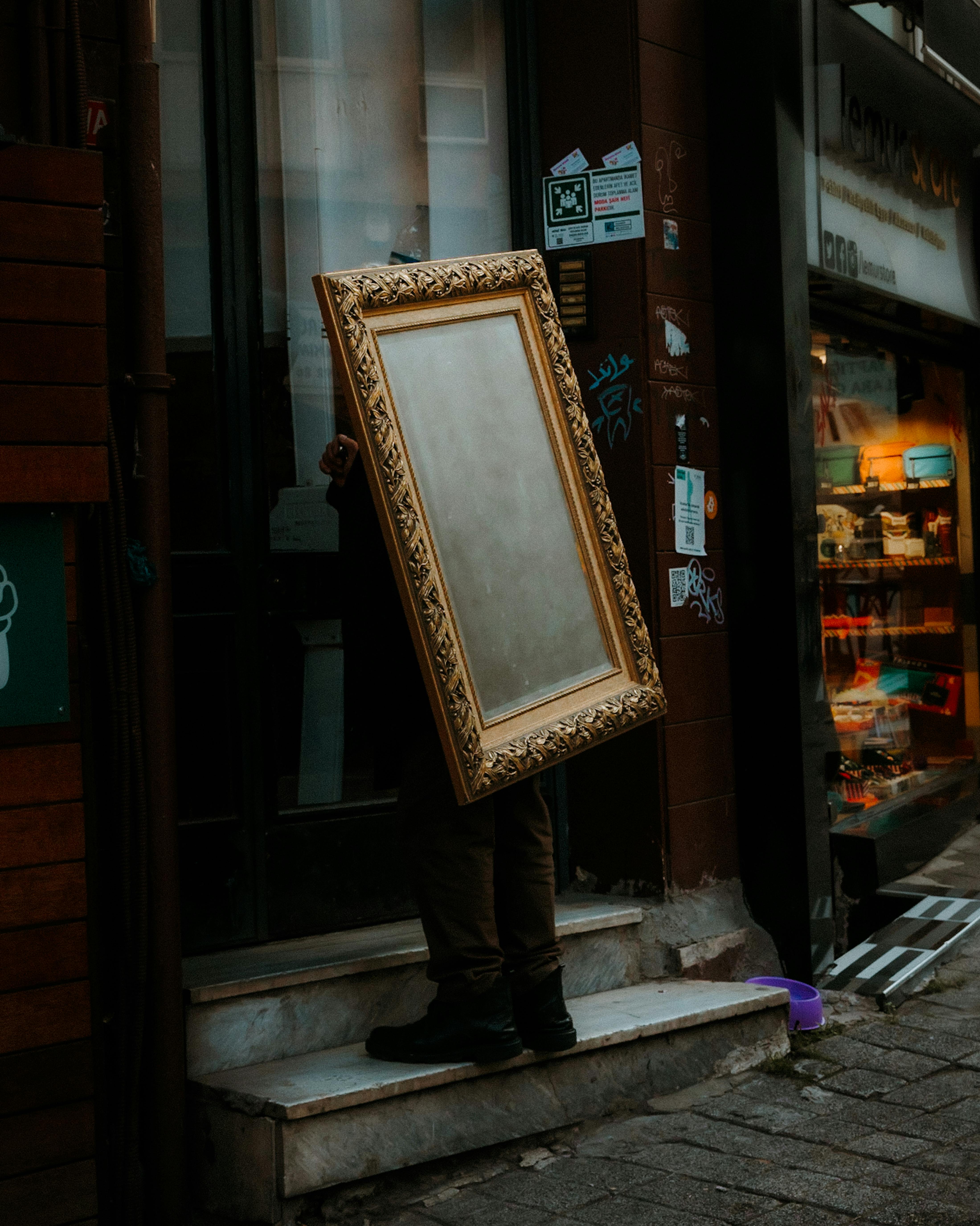 Man Carrying Painting Frame · Free Stock Photo