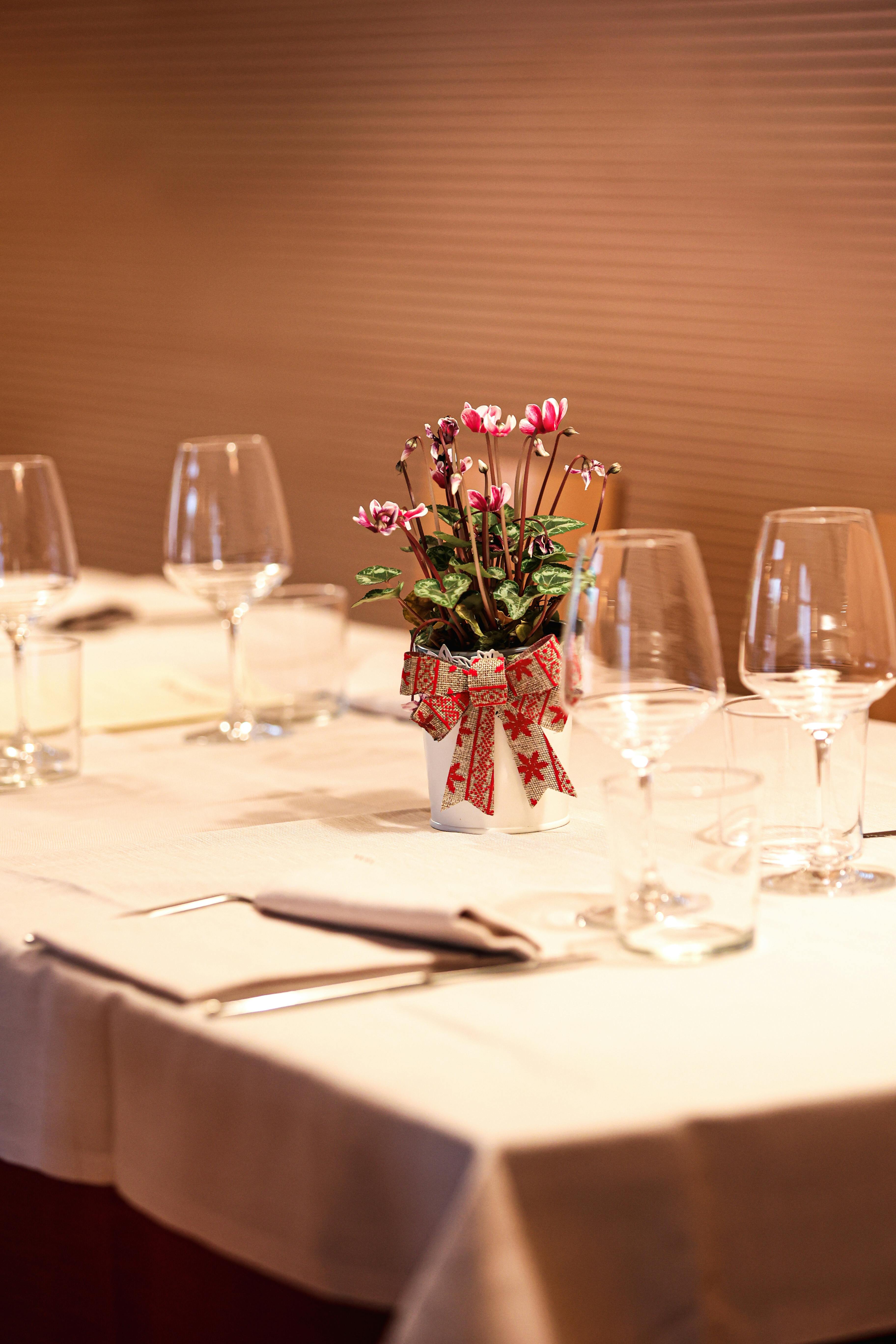 Tableware and Flowers on the Tables in the Restaurant · Free Stock Photo