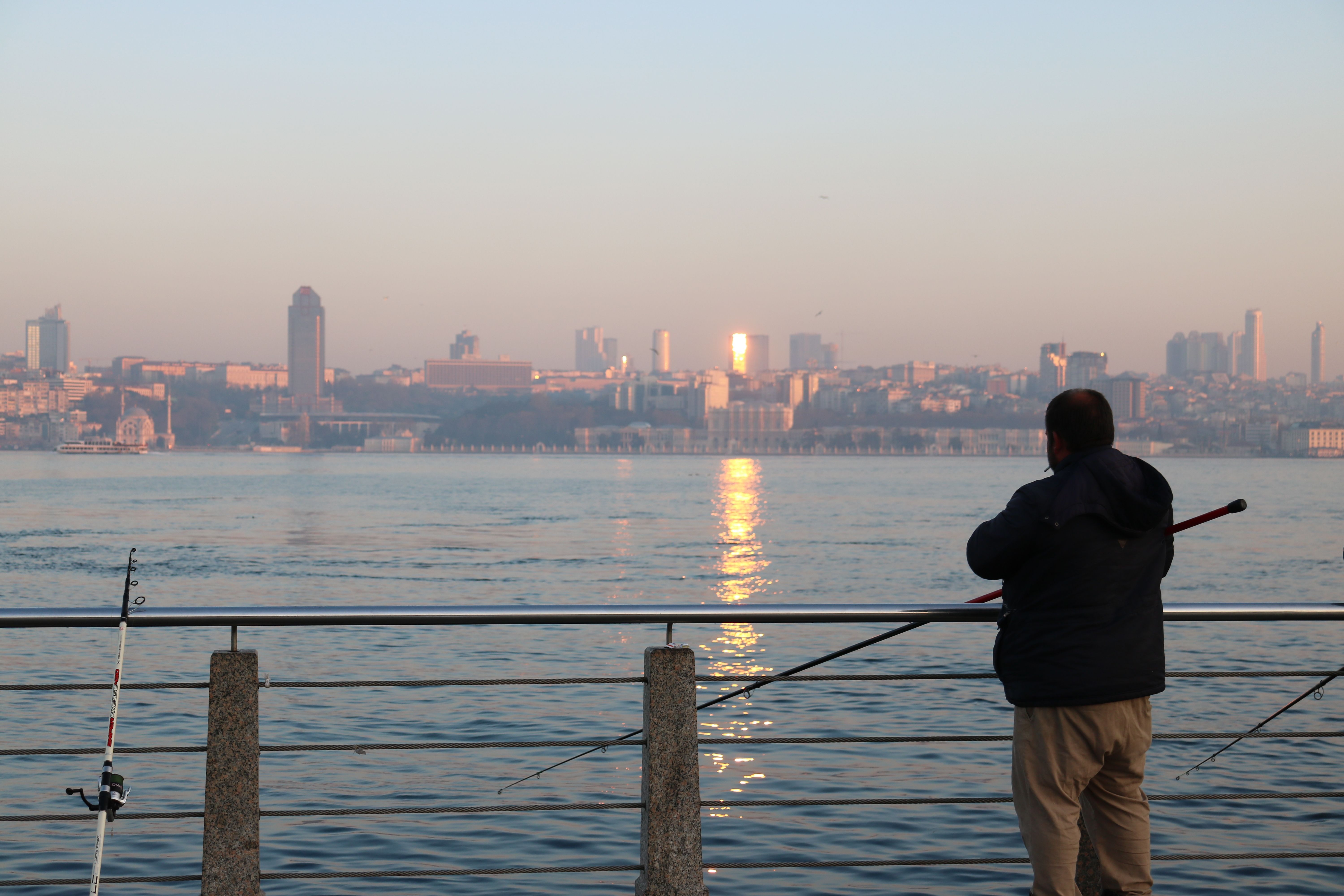 Back View Shot of a Man Fishing on a River · Free Stock Photo