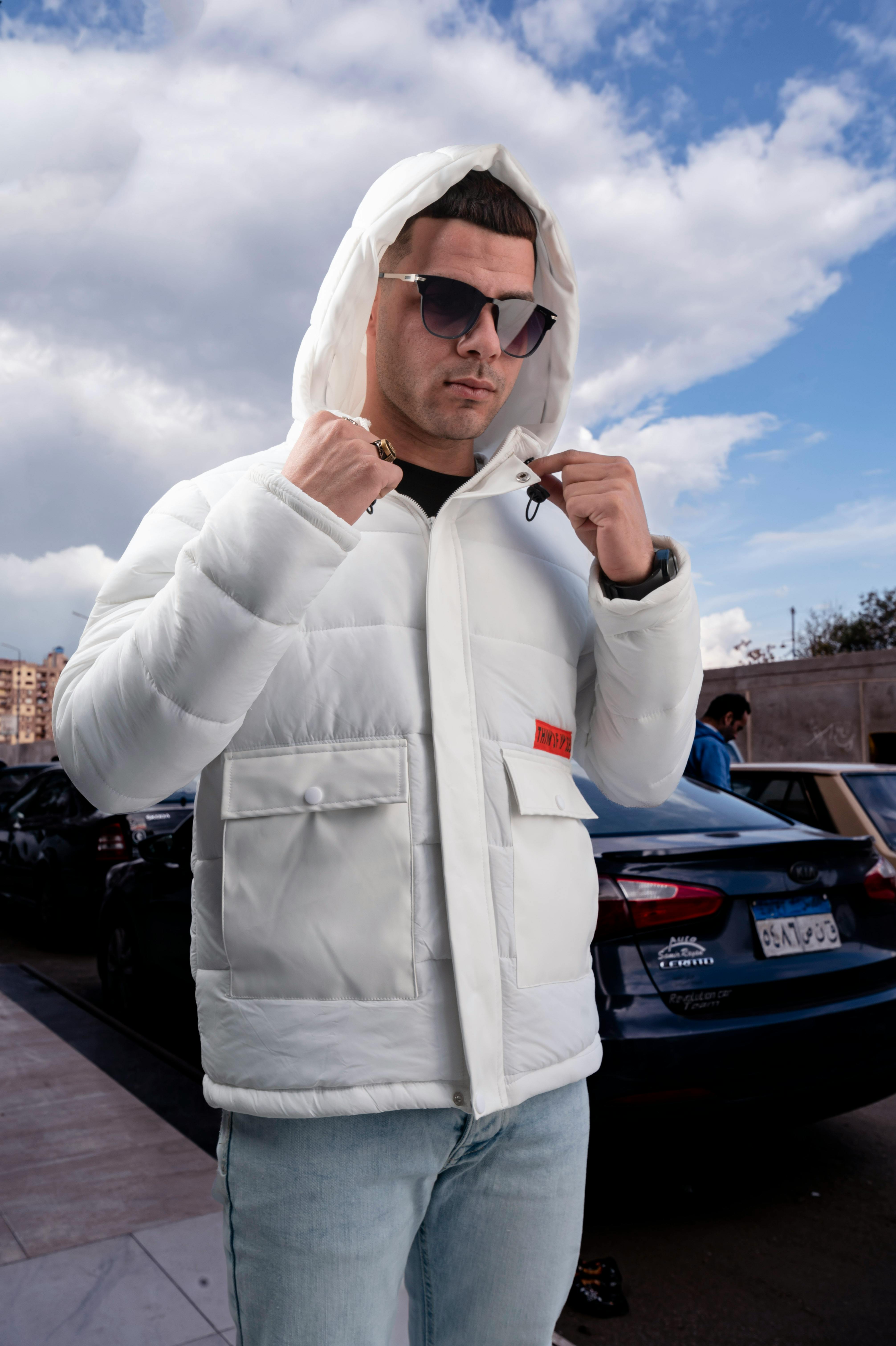 Man in Yellow Puffer Jacket Posing · Free Stock Photo