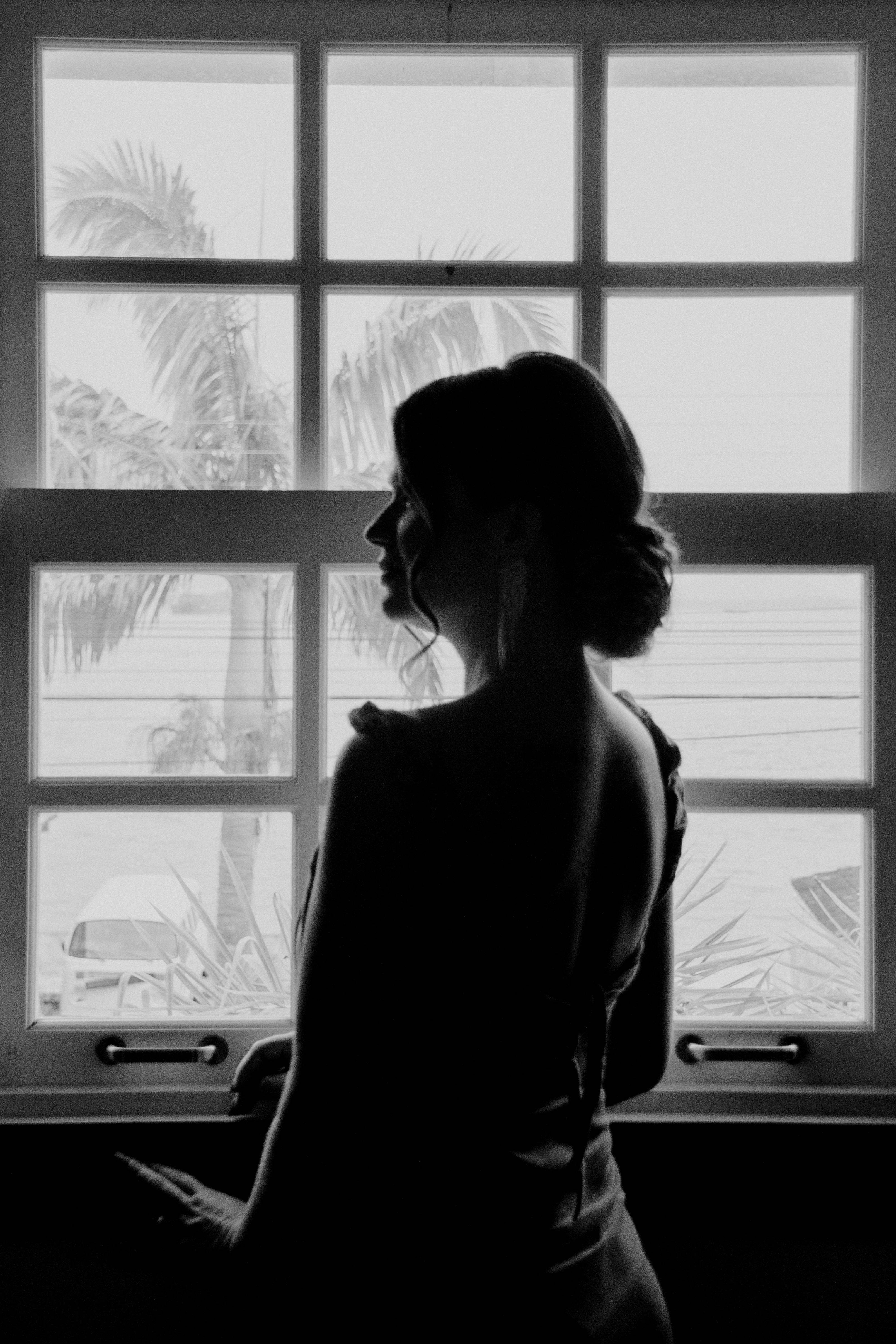 Black and White Photo of Woman Standing in Front of a Window · Free ...