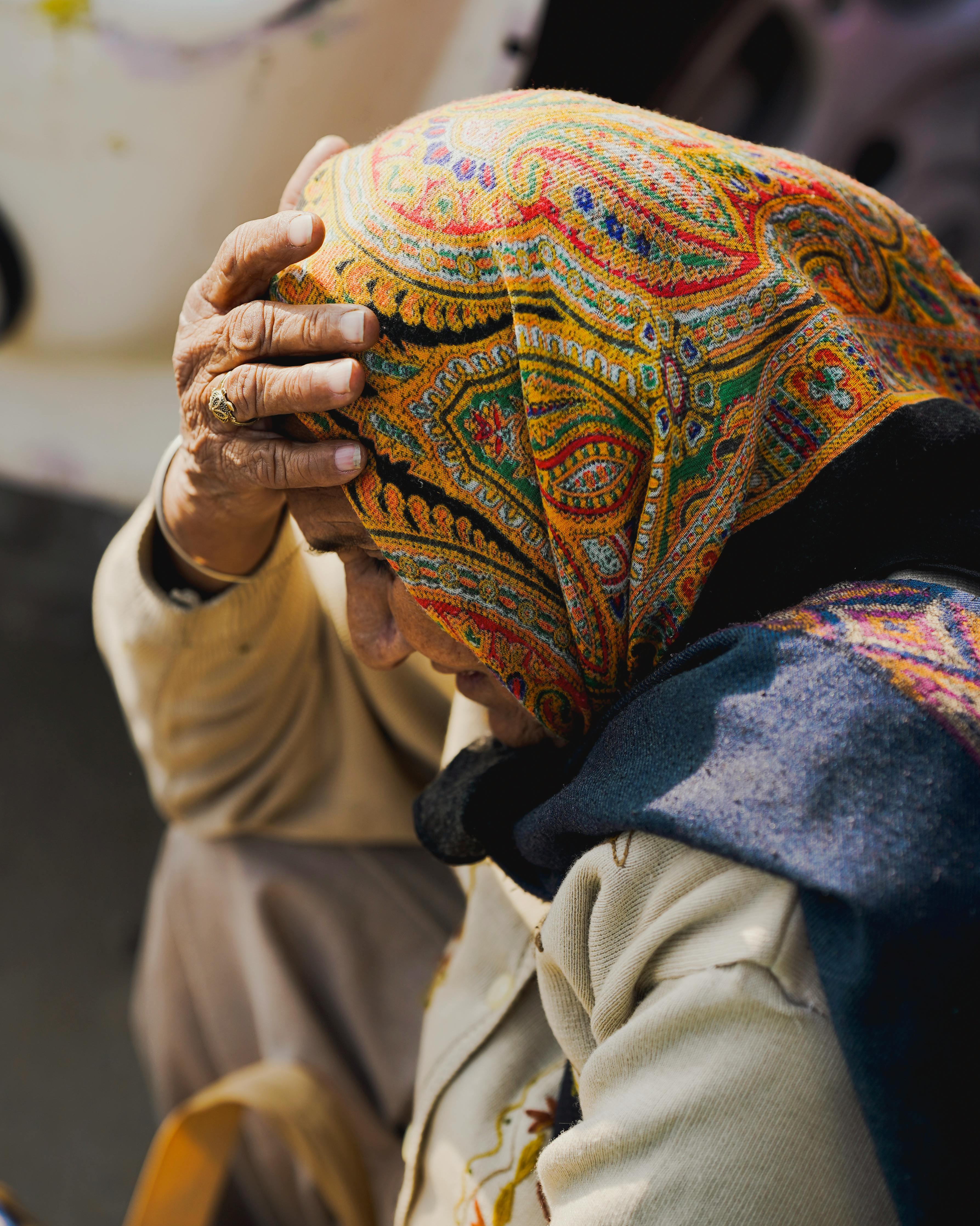 A Woman in a Coat Praying · Free Stock Photo