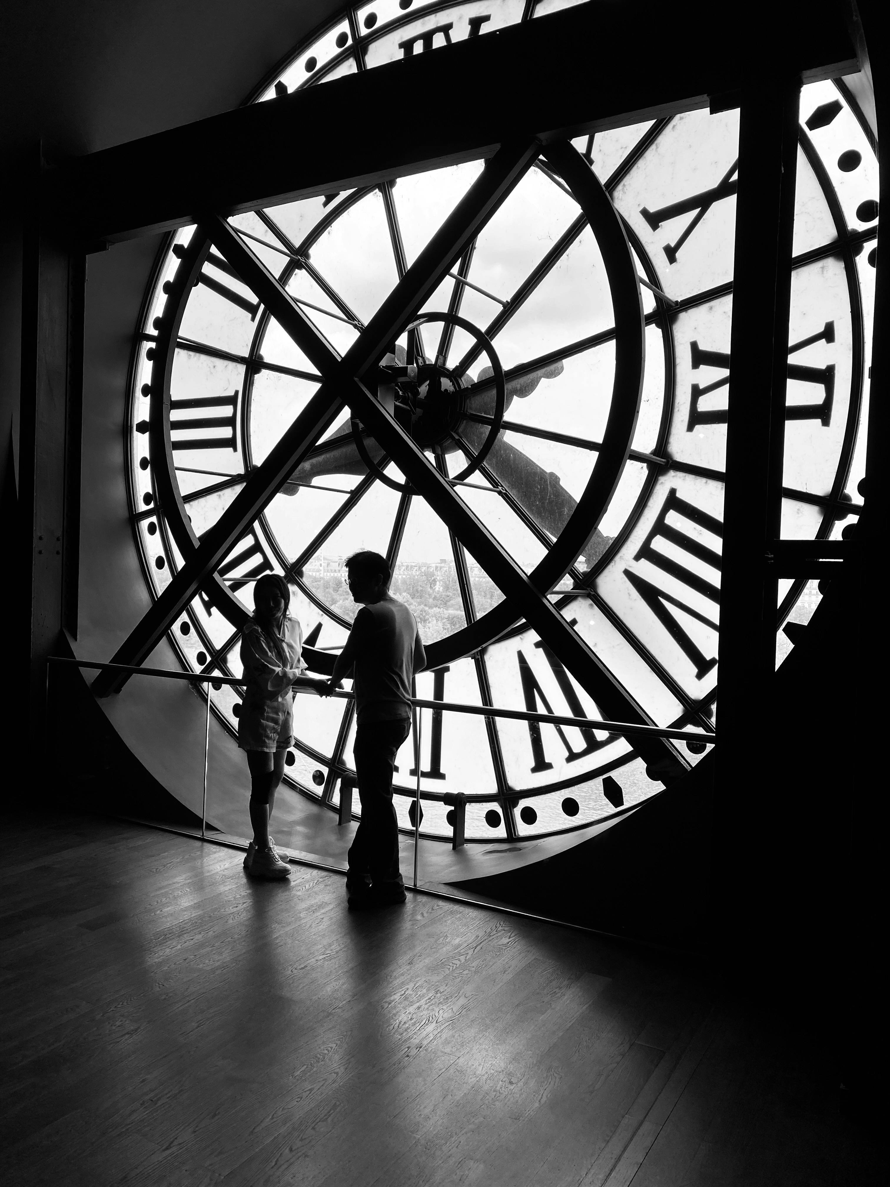 Woman Standing in Clock Building · Free Stock Photo