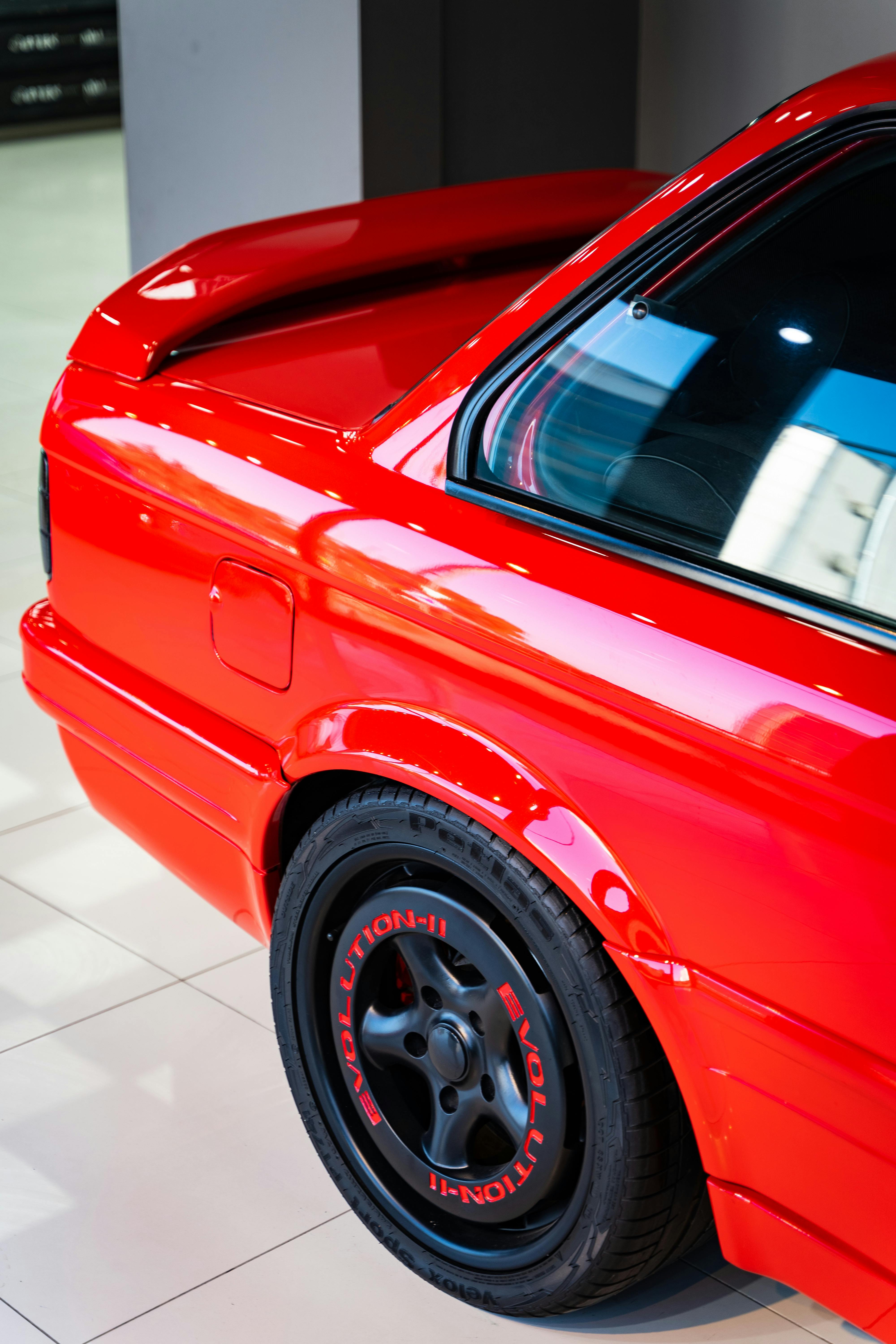 Red Sedan Car on Exhibition · Free Stock Photo