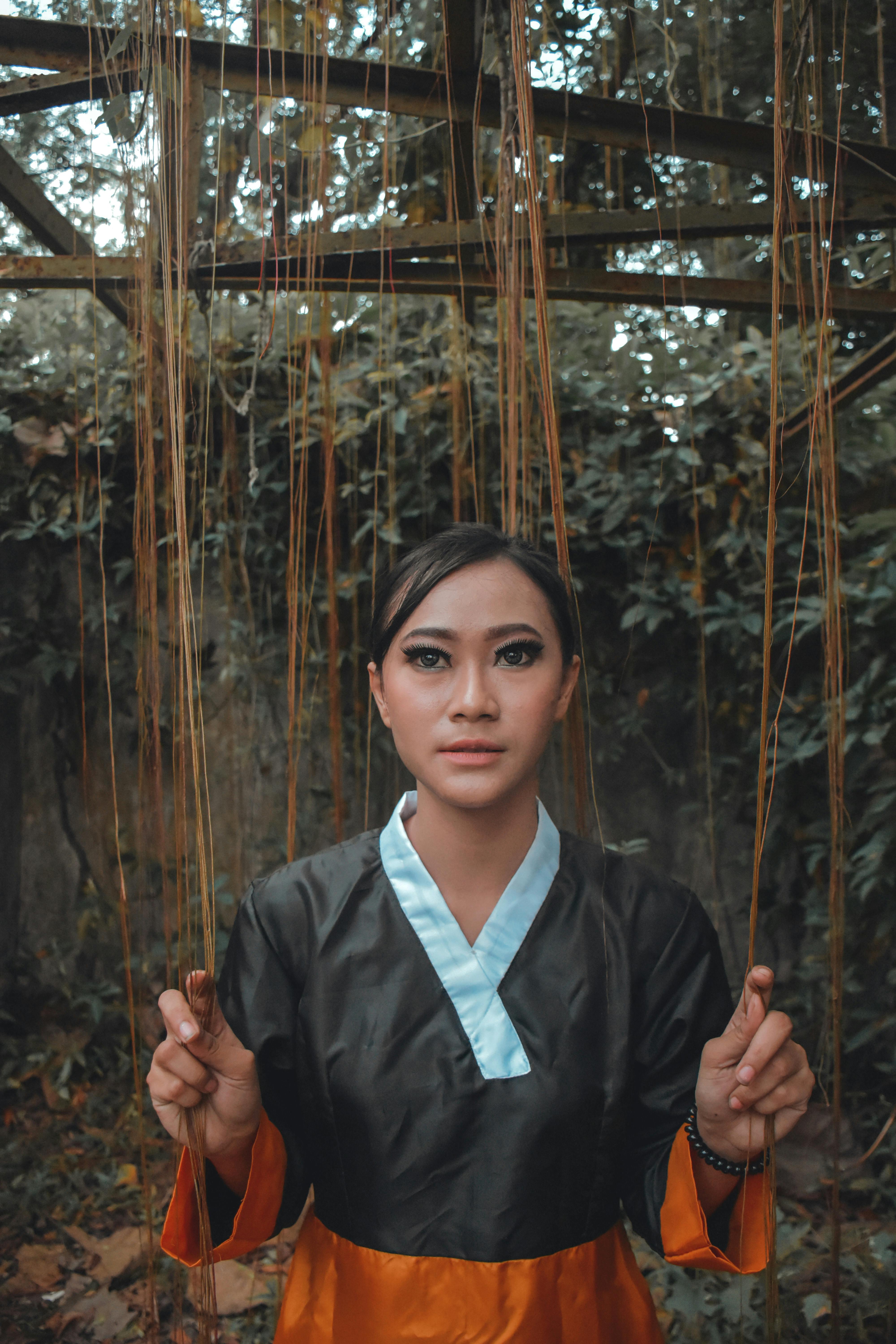 Portrait of Woman Holding Strings · Free Stock Photo