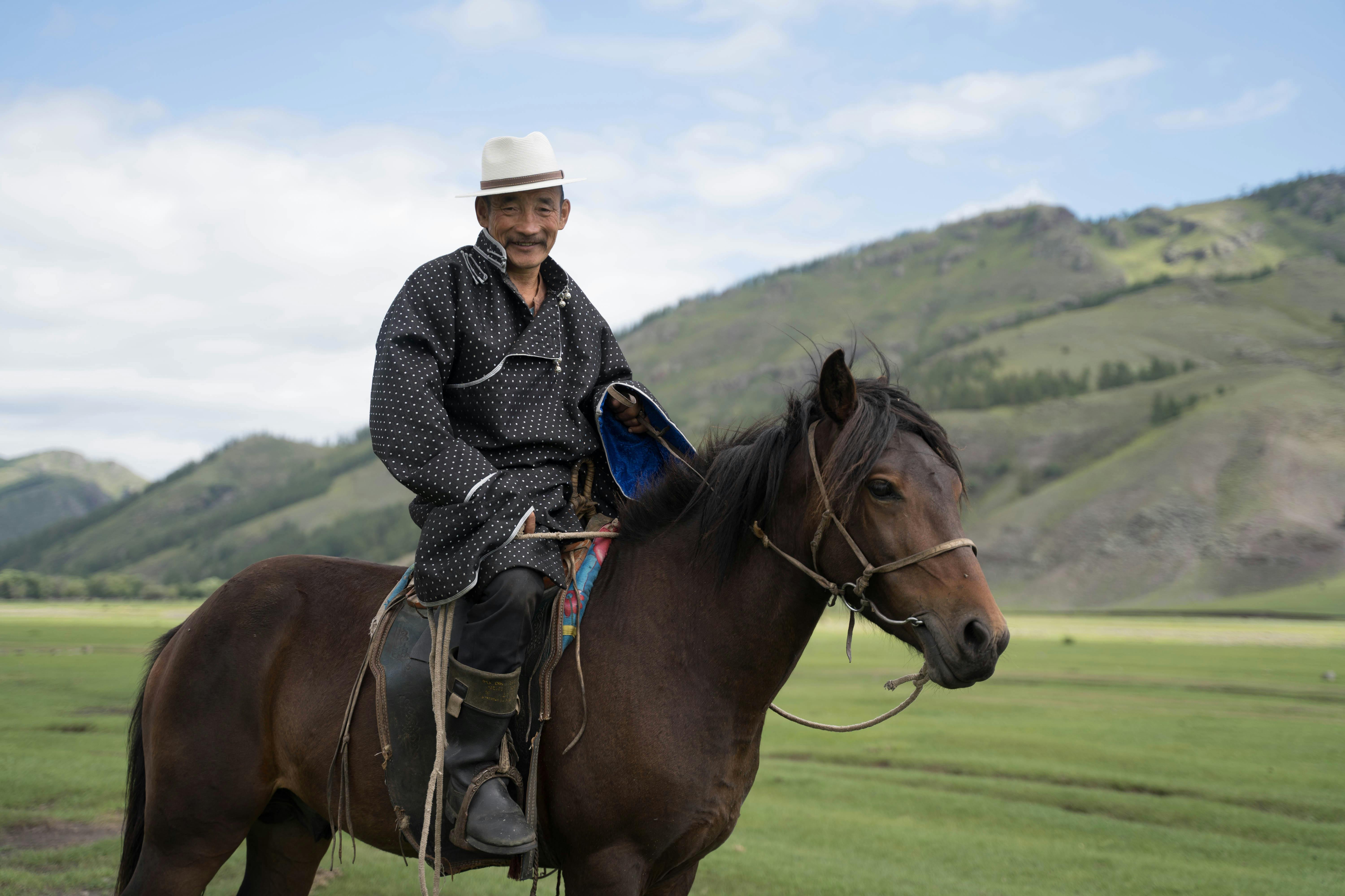 Man Horseback Riding in Mountains · Free Stock Photo