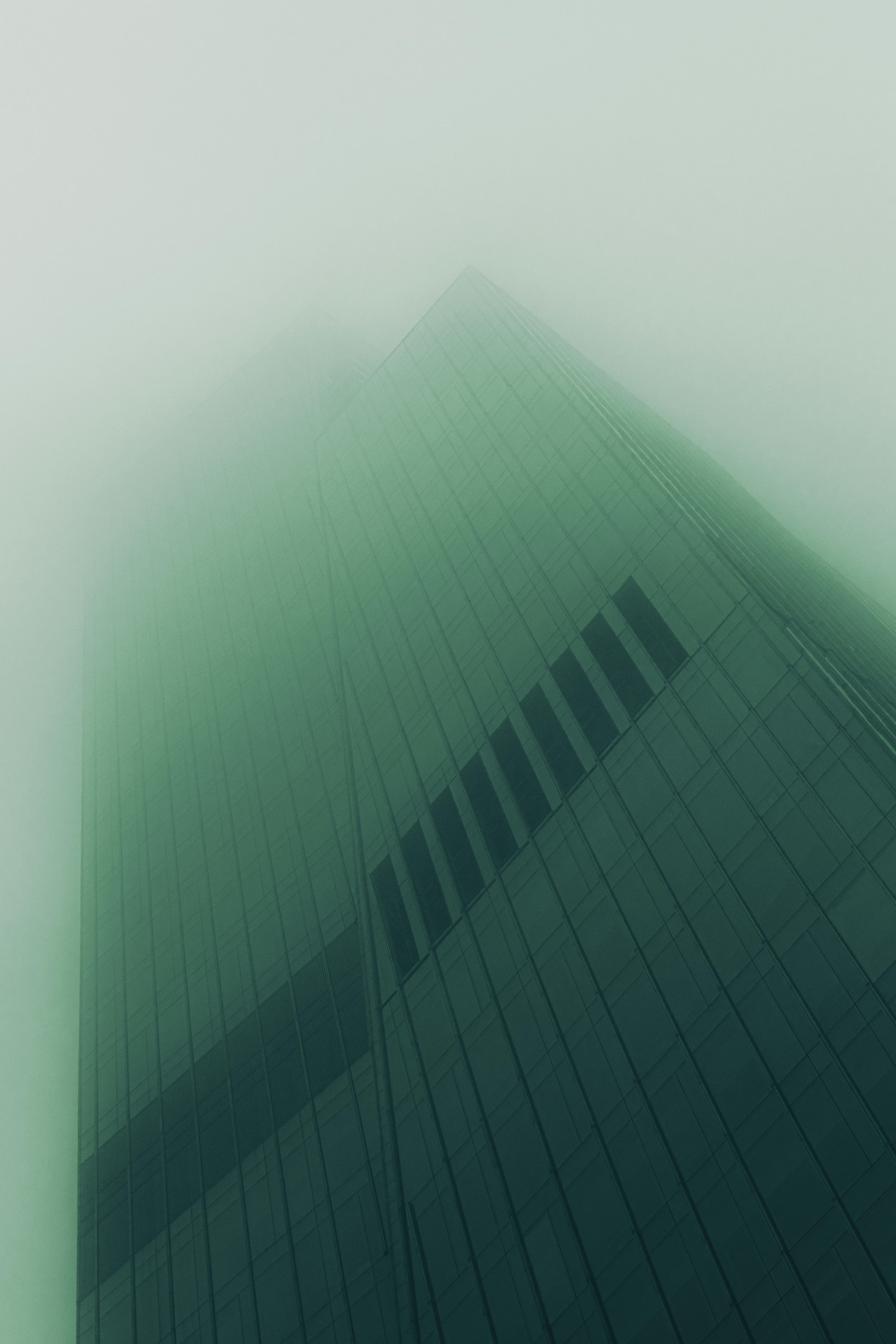 Low Angle Shot of a Skyscraper in Fog · Free Stock Photo