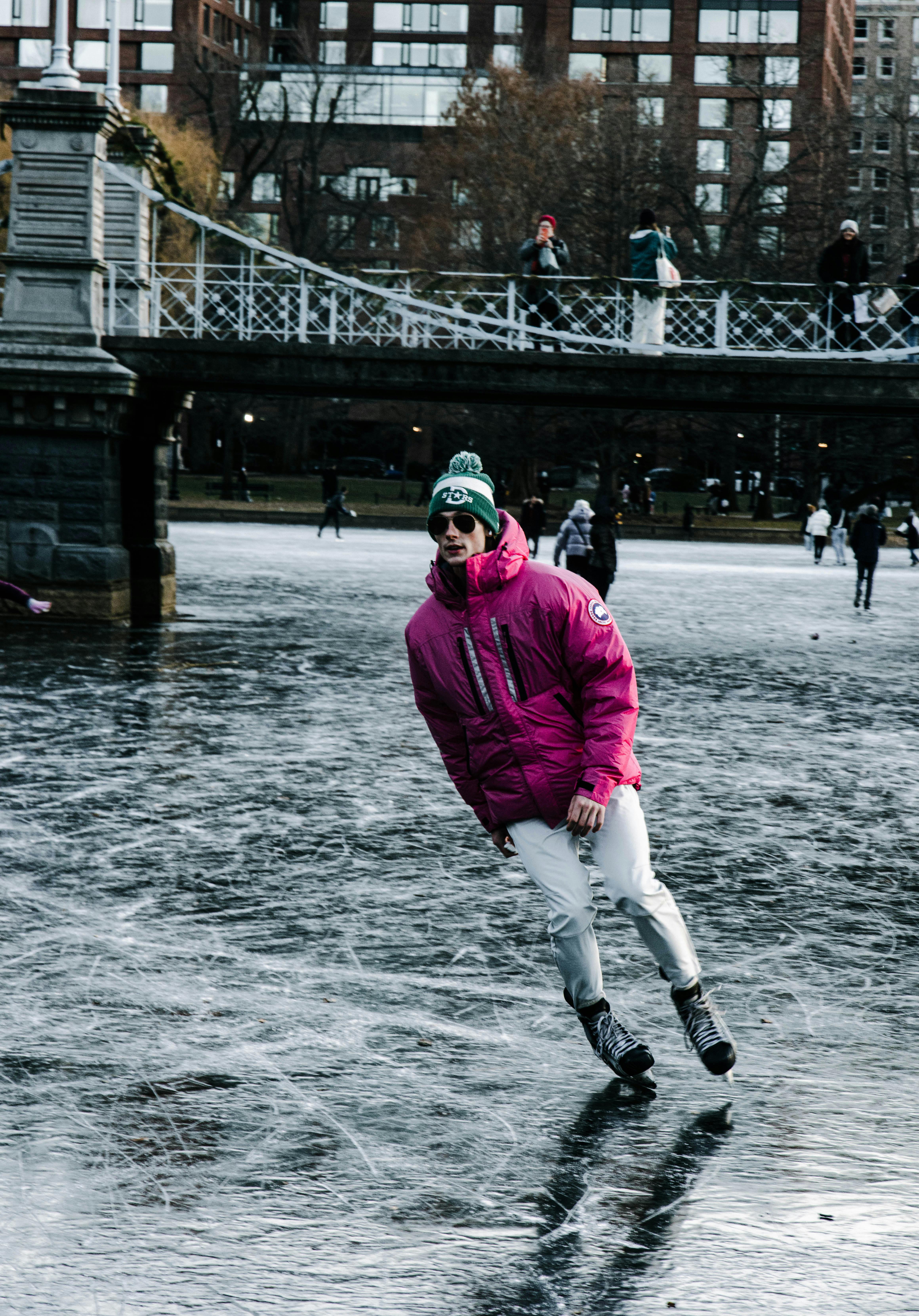 Man Ice Skating on an Ice Rink in City · Free Stock Photo