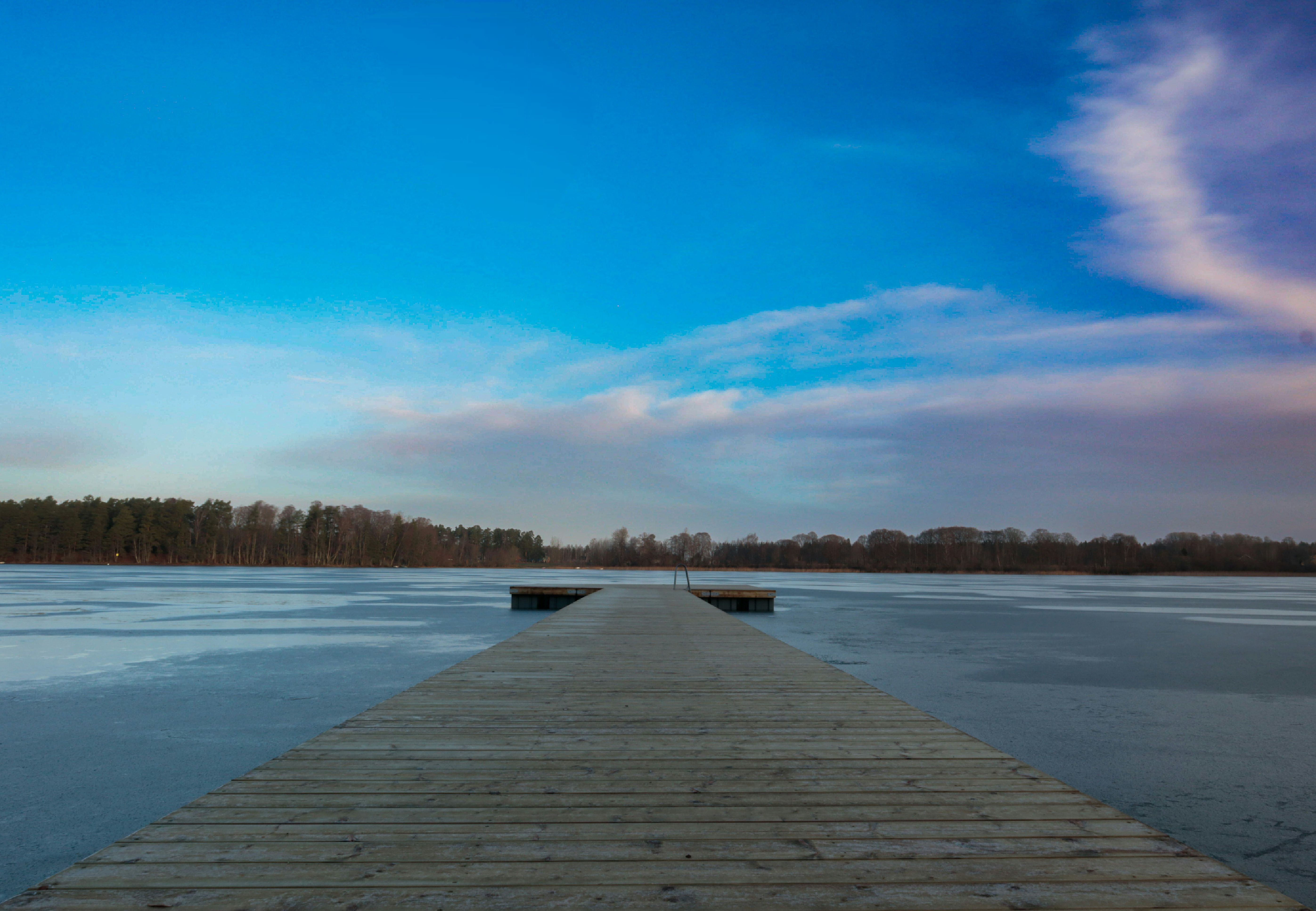 Wooden Dock on the Lake under the Cloudy Blue Sky · Free Stock Photo