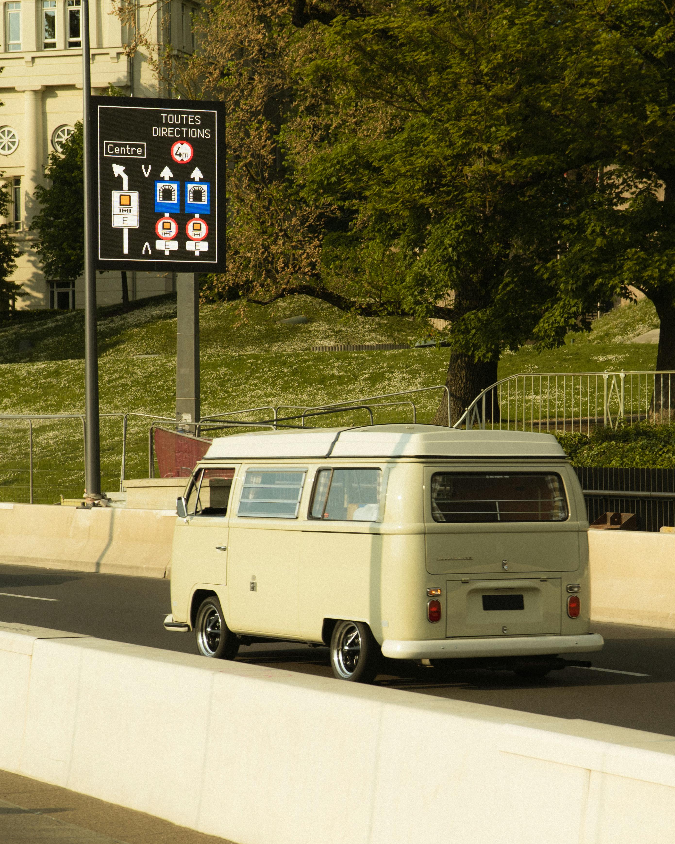 A Van Driving Down the Road · Free Stock Photo
