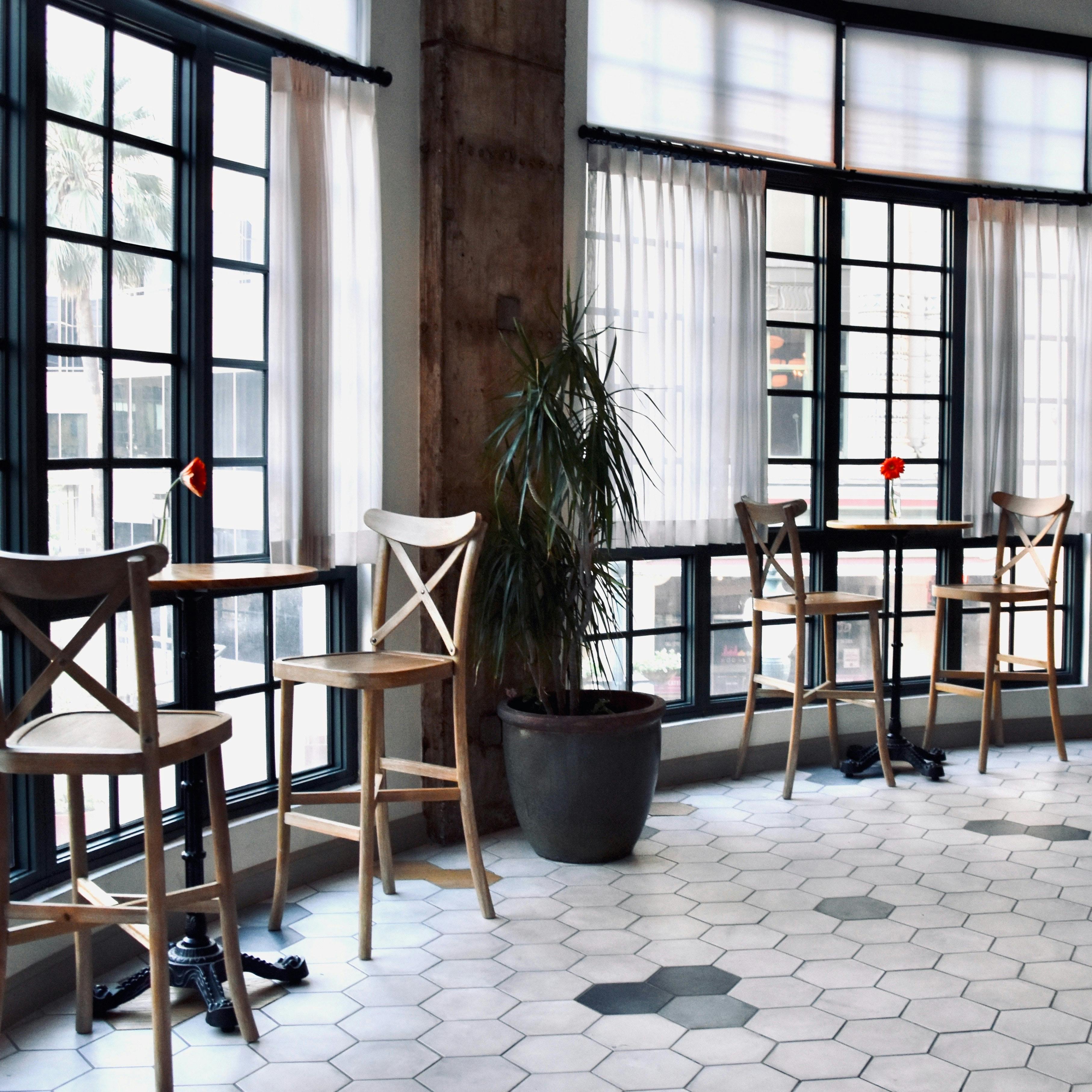 Brown Chairs and Table Beside the Window · Free Stock Photo