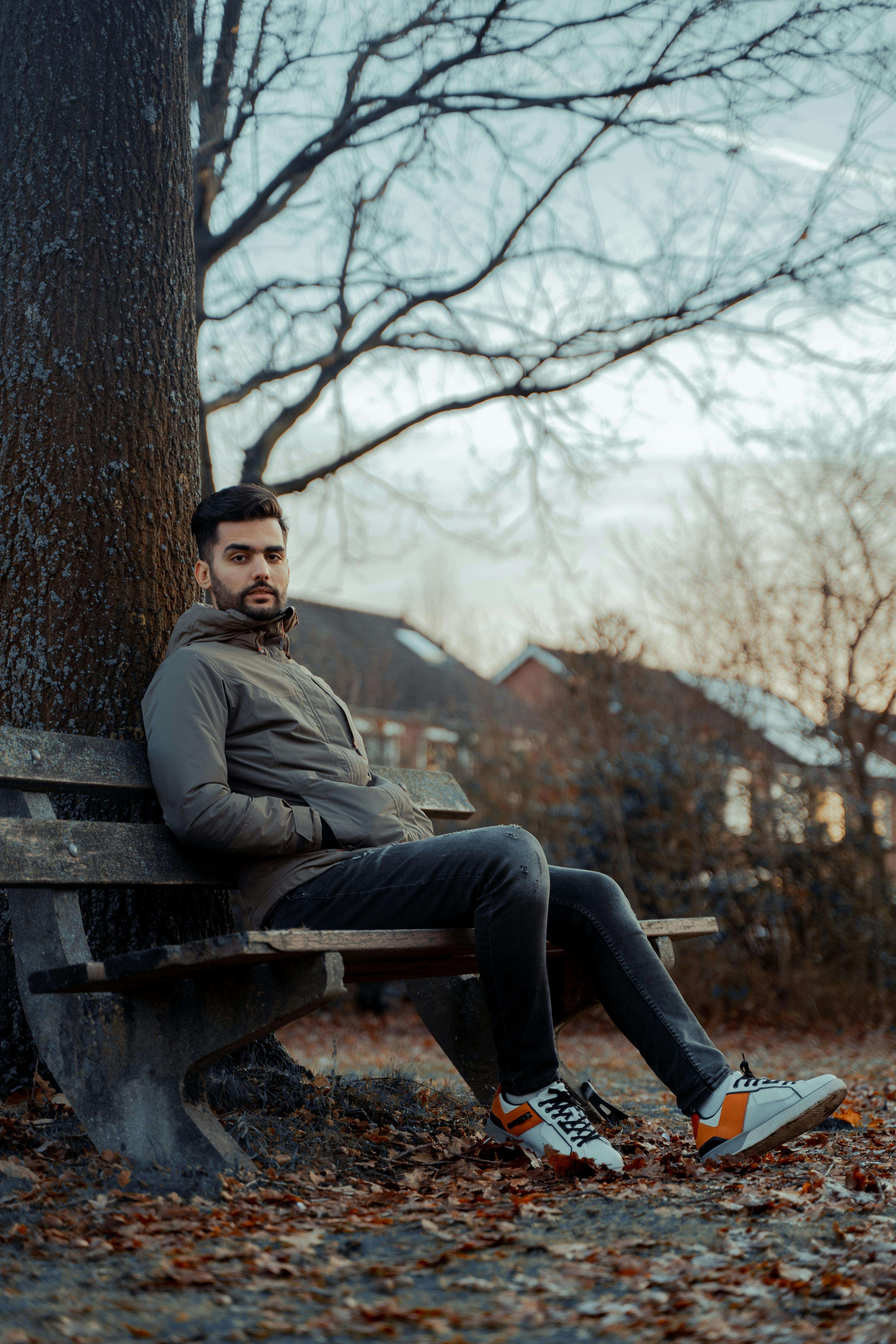 Man Sitting on a Bench · Free Stock Photo