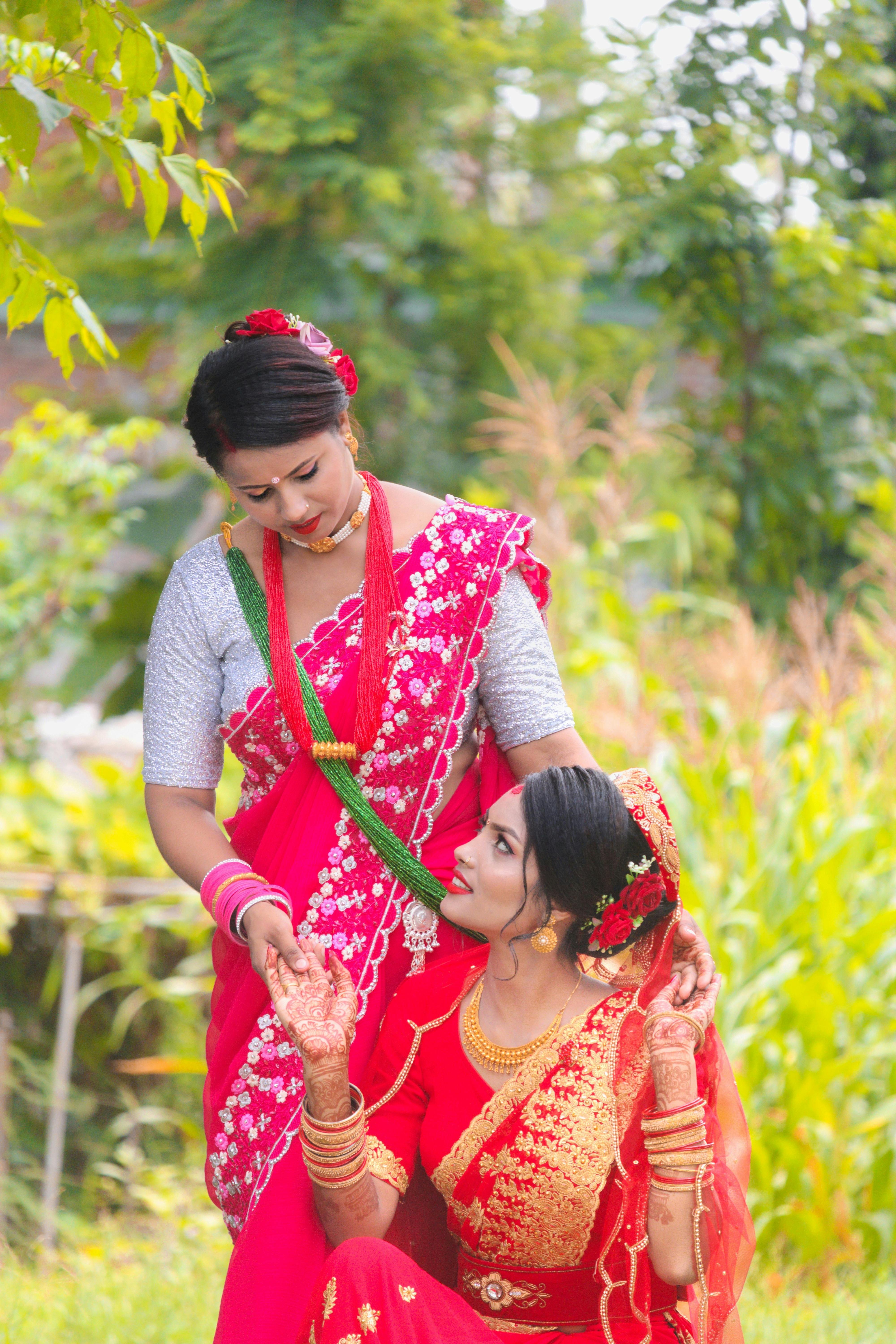 Women Wearing Red Traditional Clothing Posing in a Green Garden · Free ...