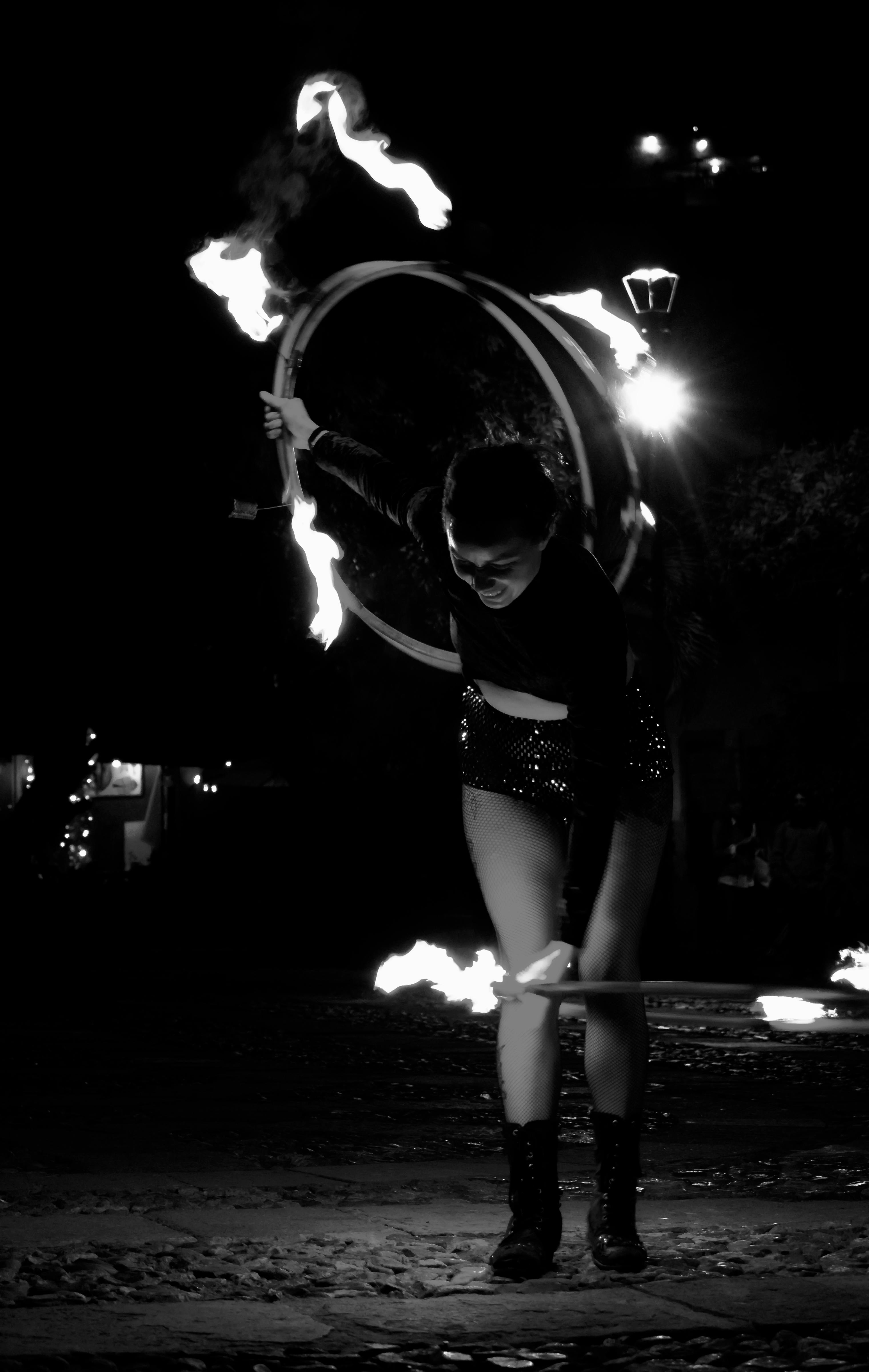Woman Performer in Black Corset Dancing with Fire · Free Stock Photo