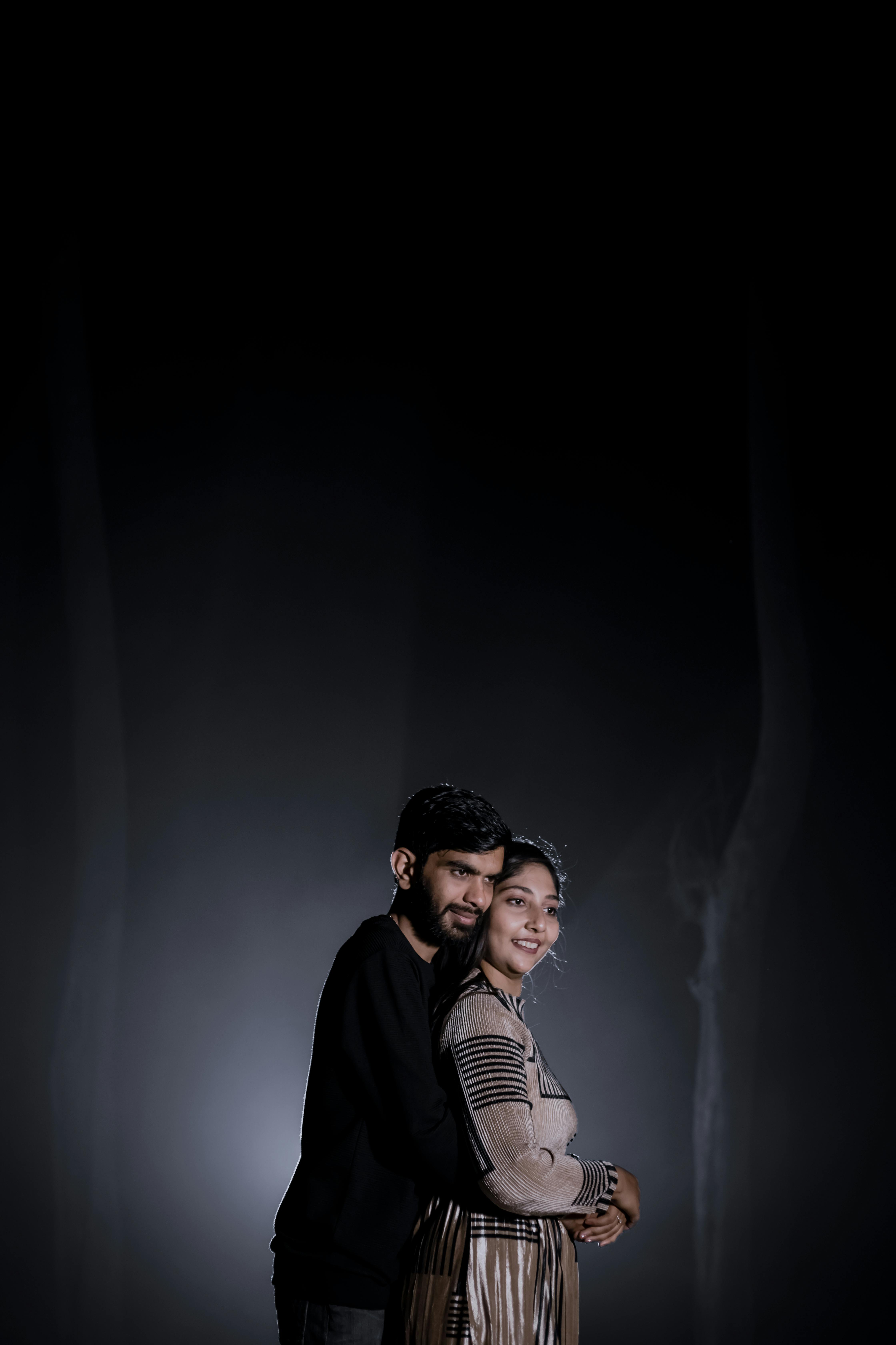 A Man Hugging a Woman · Free Stock Photo