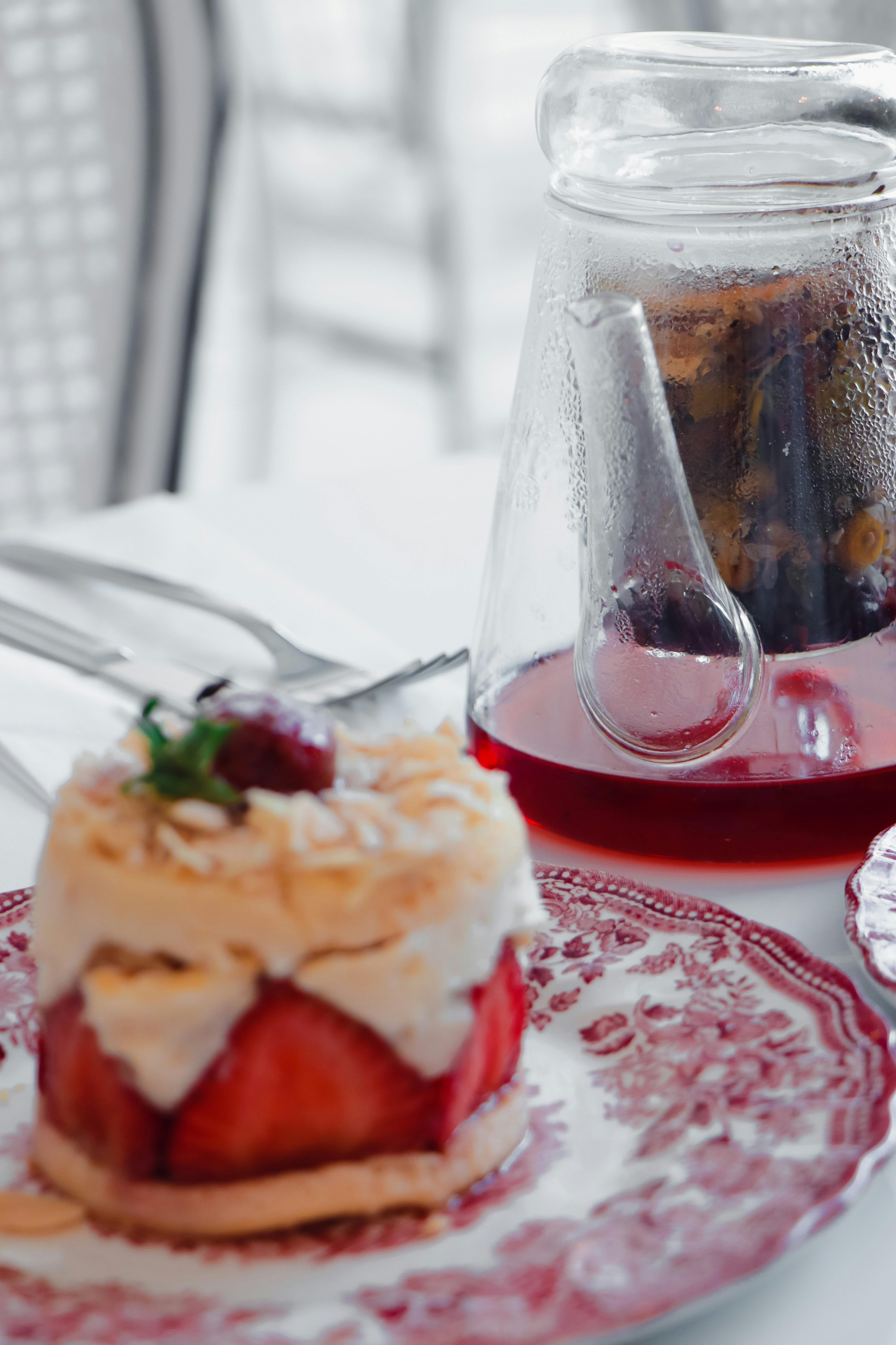 Food on a Plate near a Cup of Tea and Teapots · Free Stock Photo