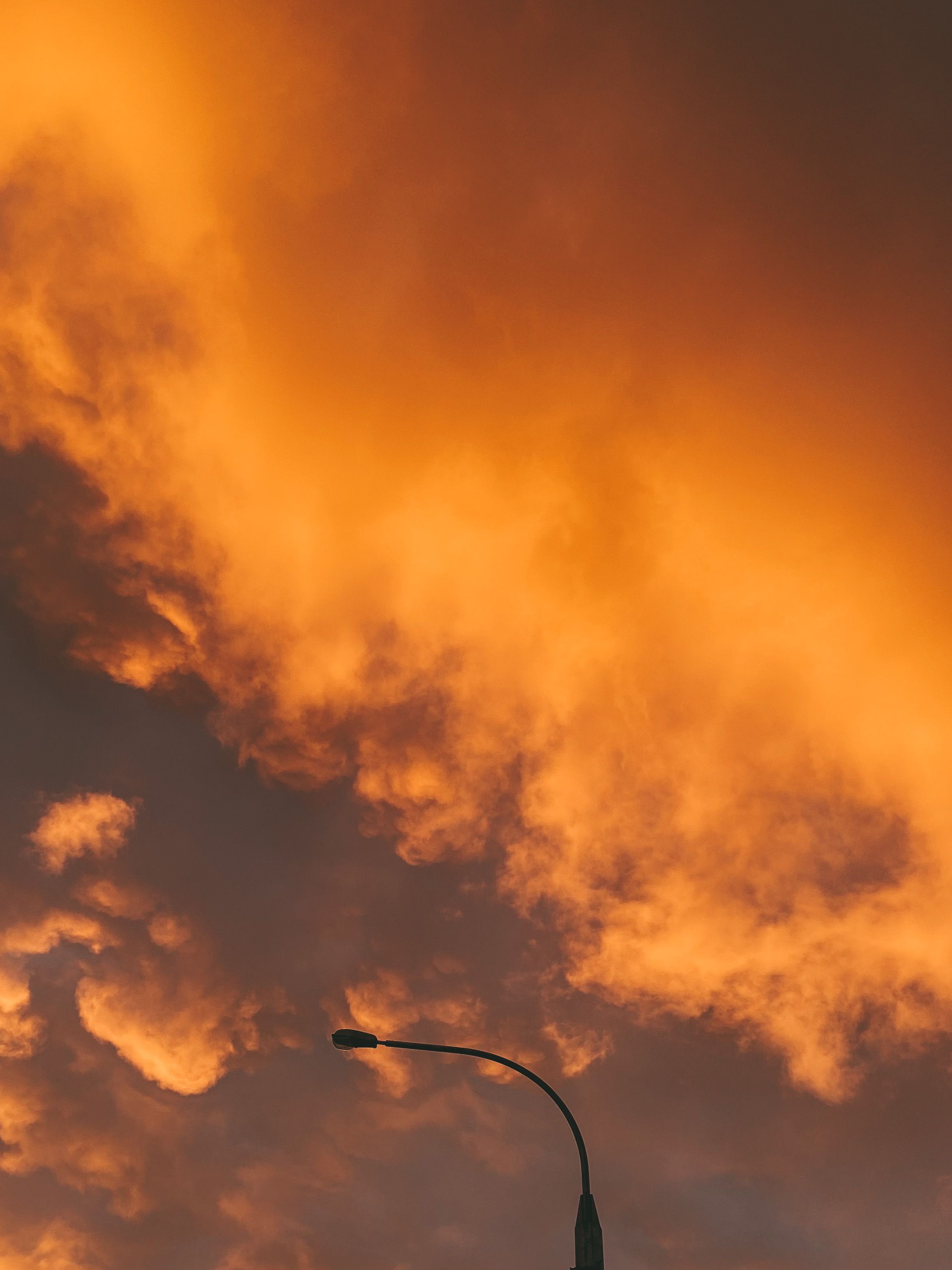 Street Light Under Thick Clouds · Free Stock Photo