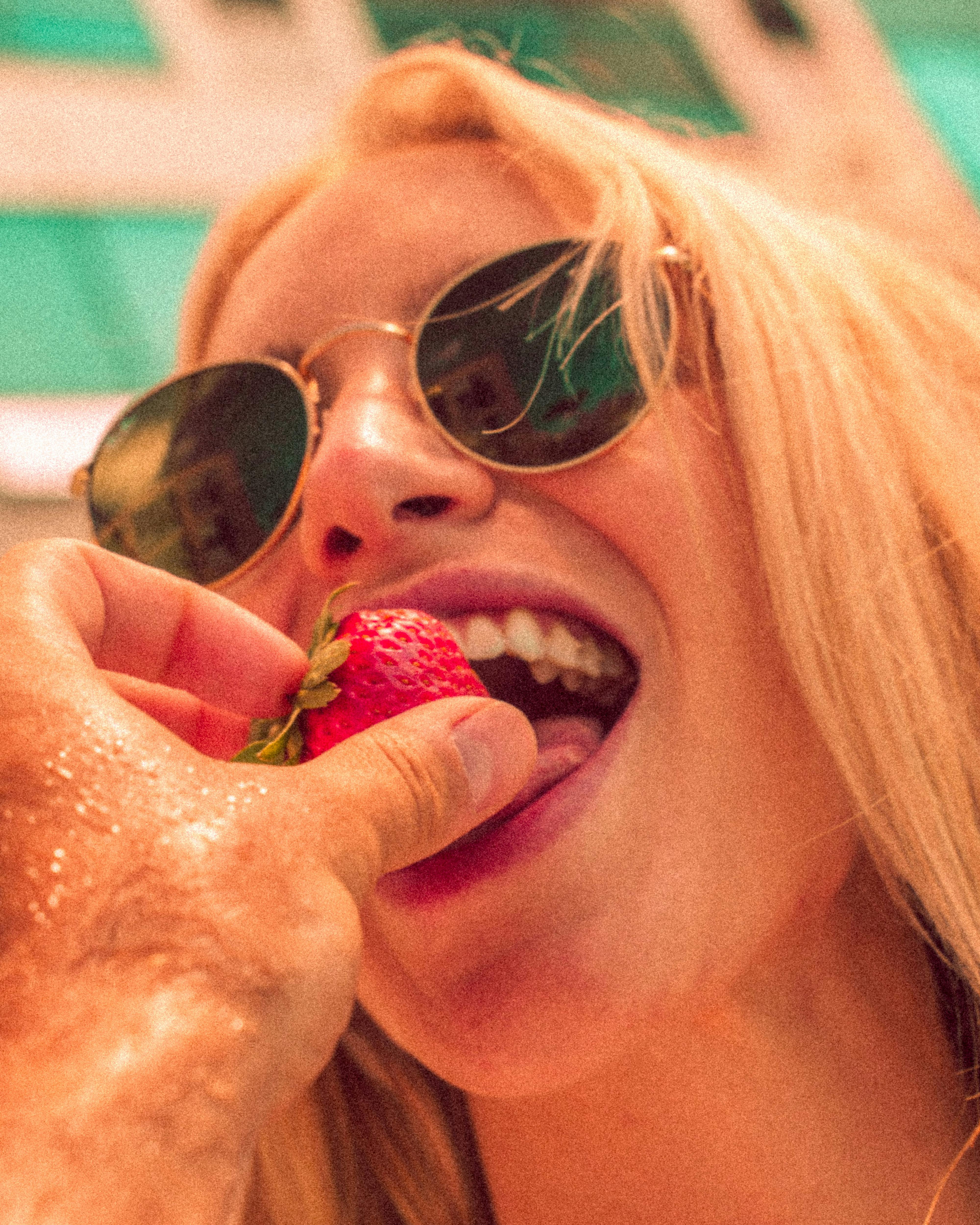 Mans Hand Giving Woman Strawberries to Eat · Free Stock Photo