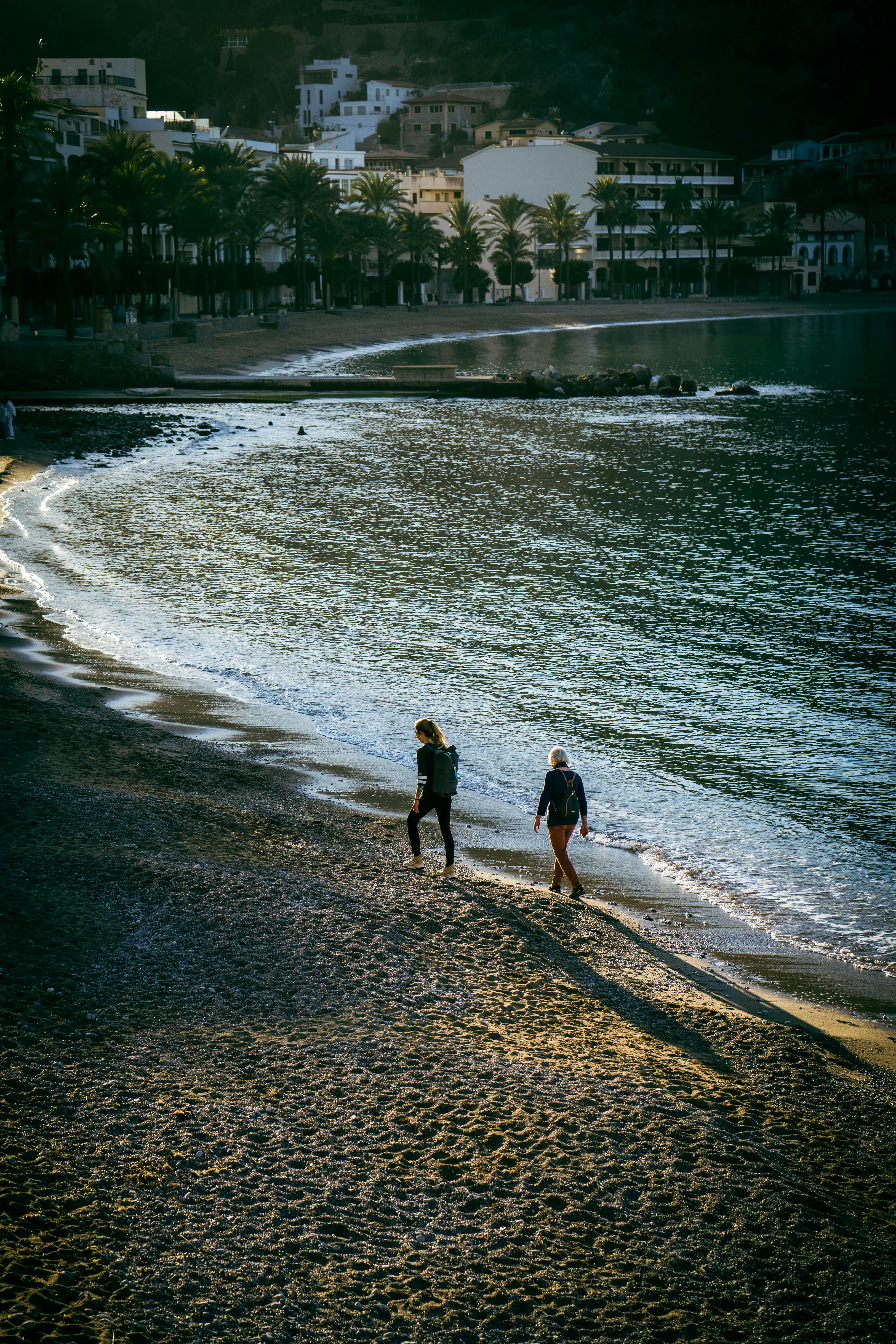 People Walking on Beach in Town · Free Stock Photo