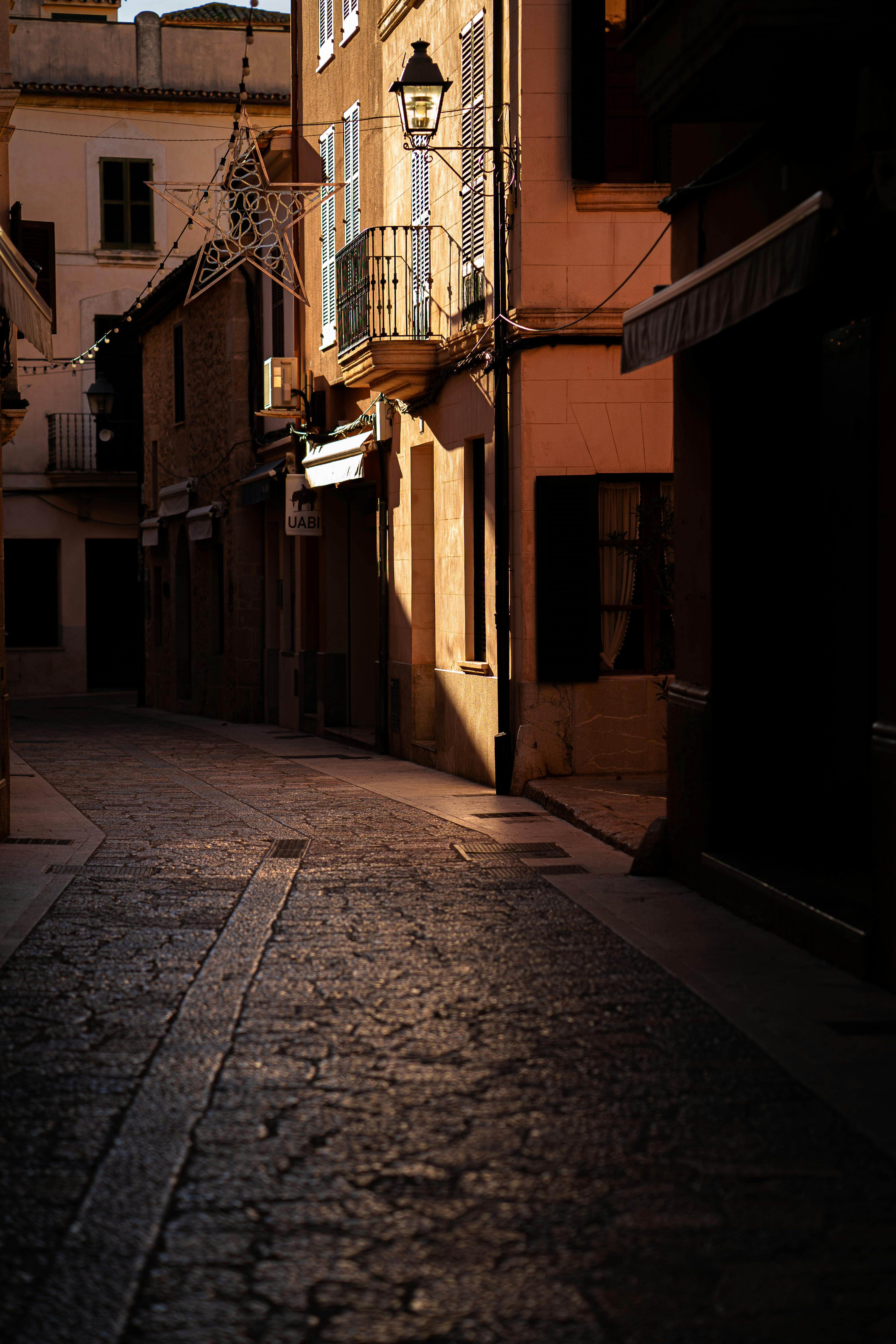 Empty Road Between Concrete Buildings · Free Stock Photo