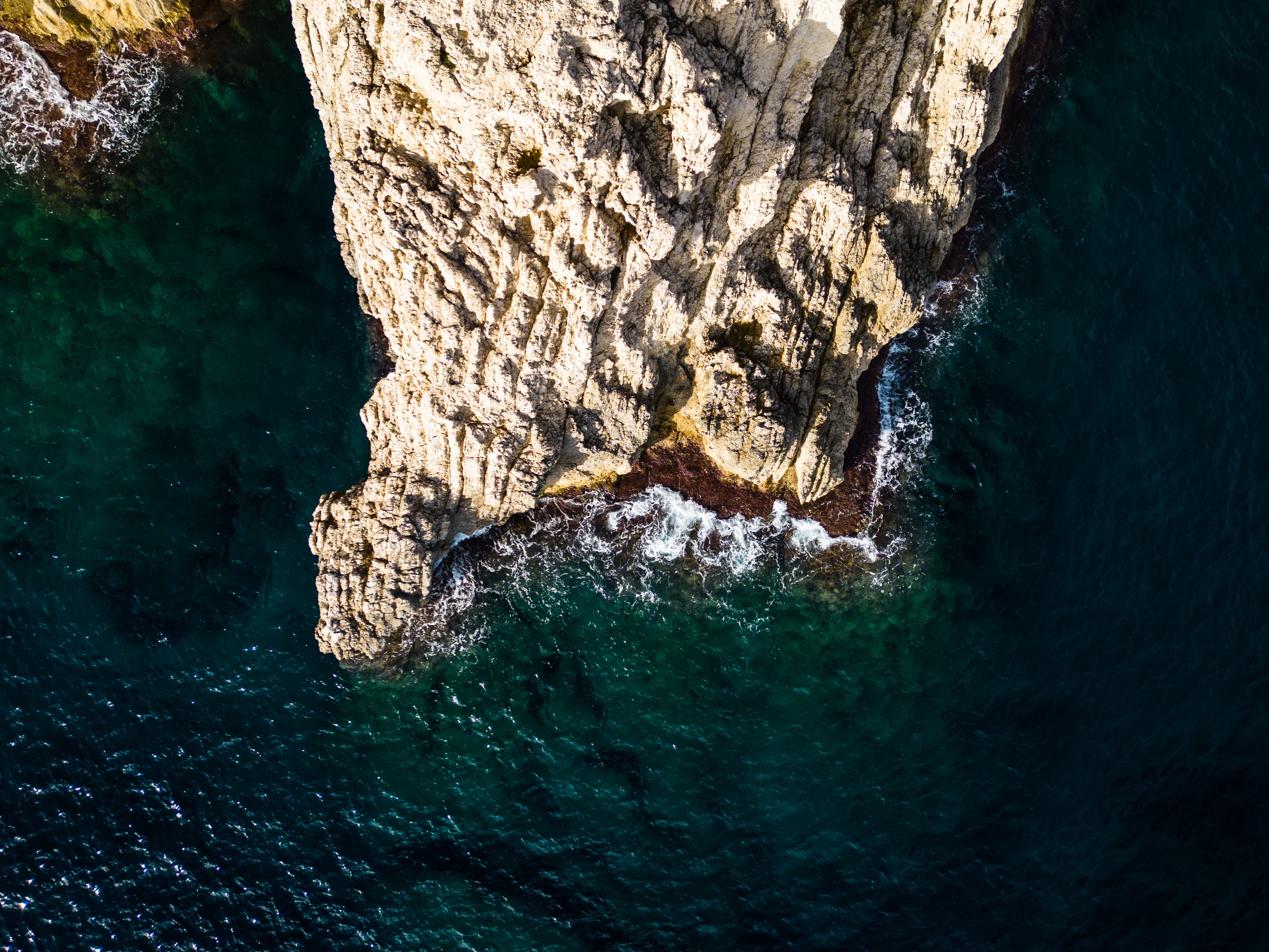 An Aerial Photography of a Rock Formation Near the Ocean · Free Stock Photo