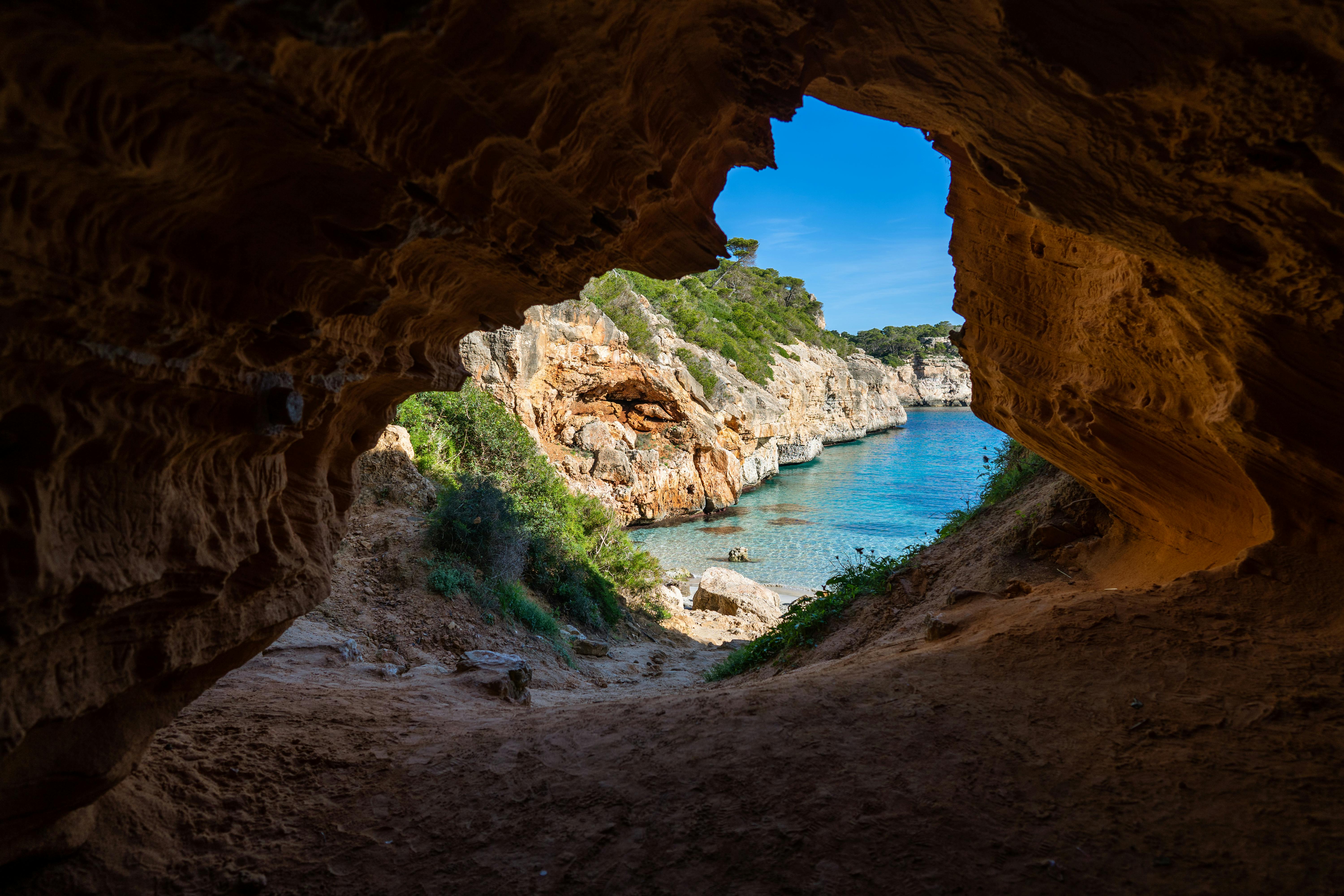 Sea Shore behind Cave Entrance · Free Stock Photo