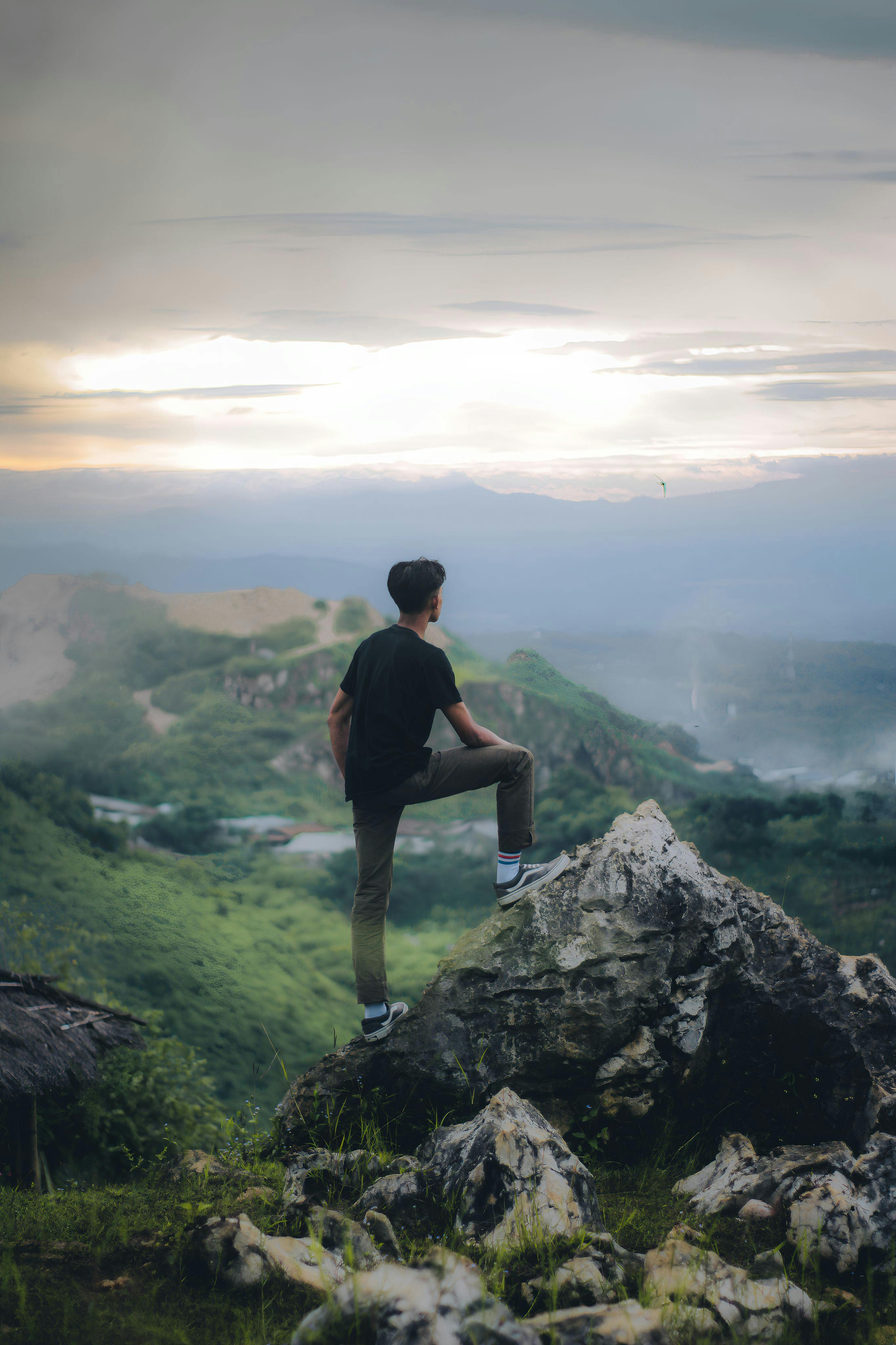 Person Standing on a Rock · Free Stock Photo